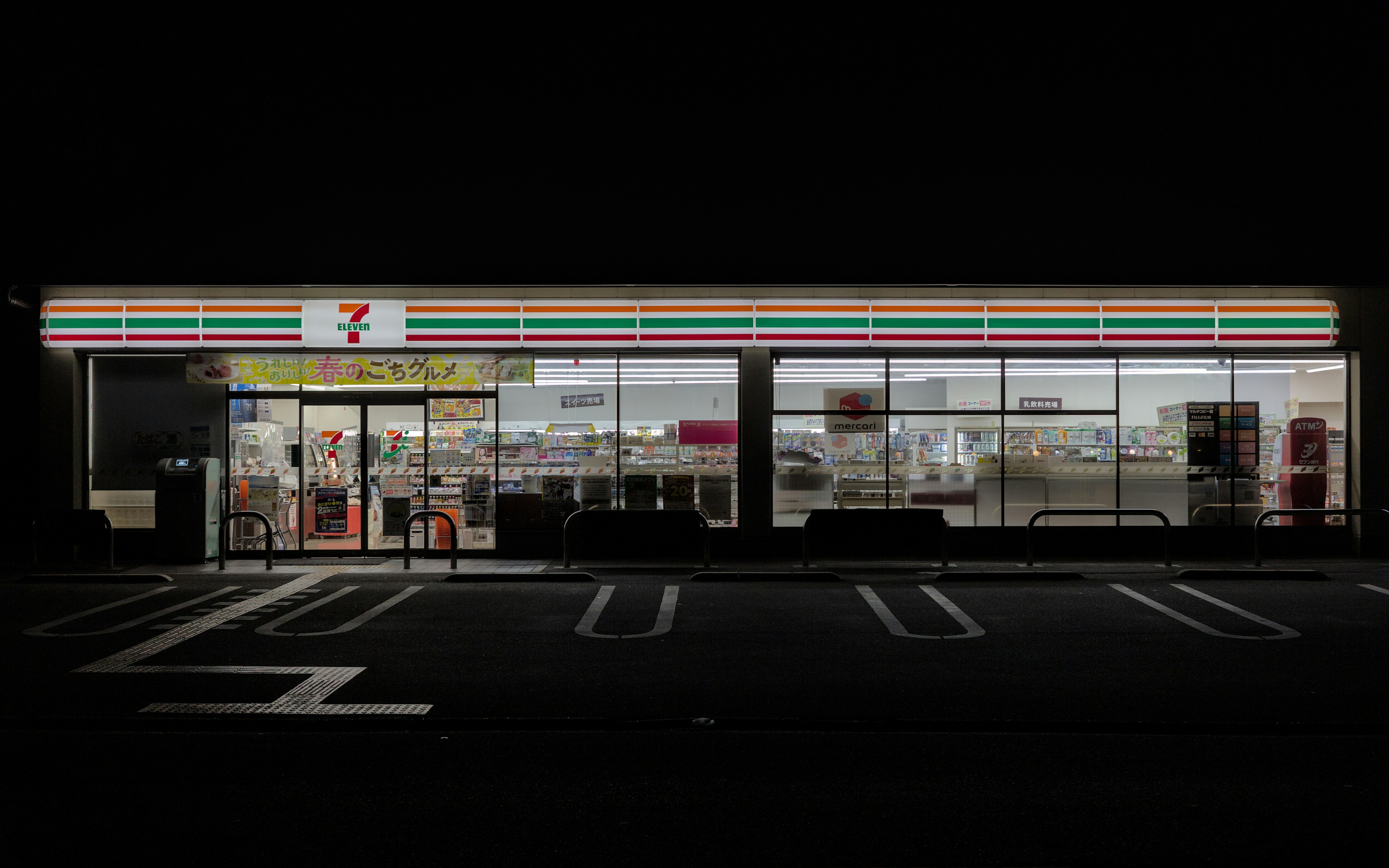 Night Glass and Neon at a Quiet Convenience Stand