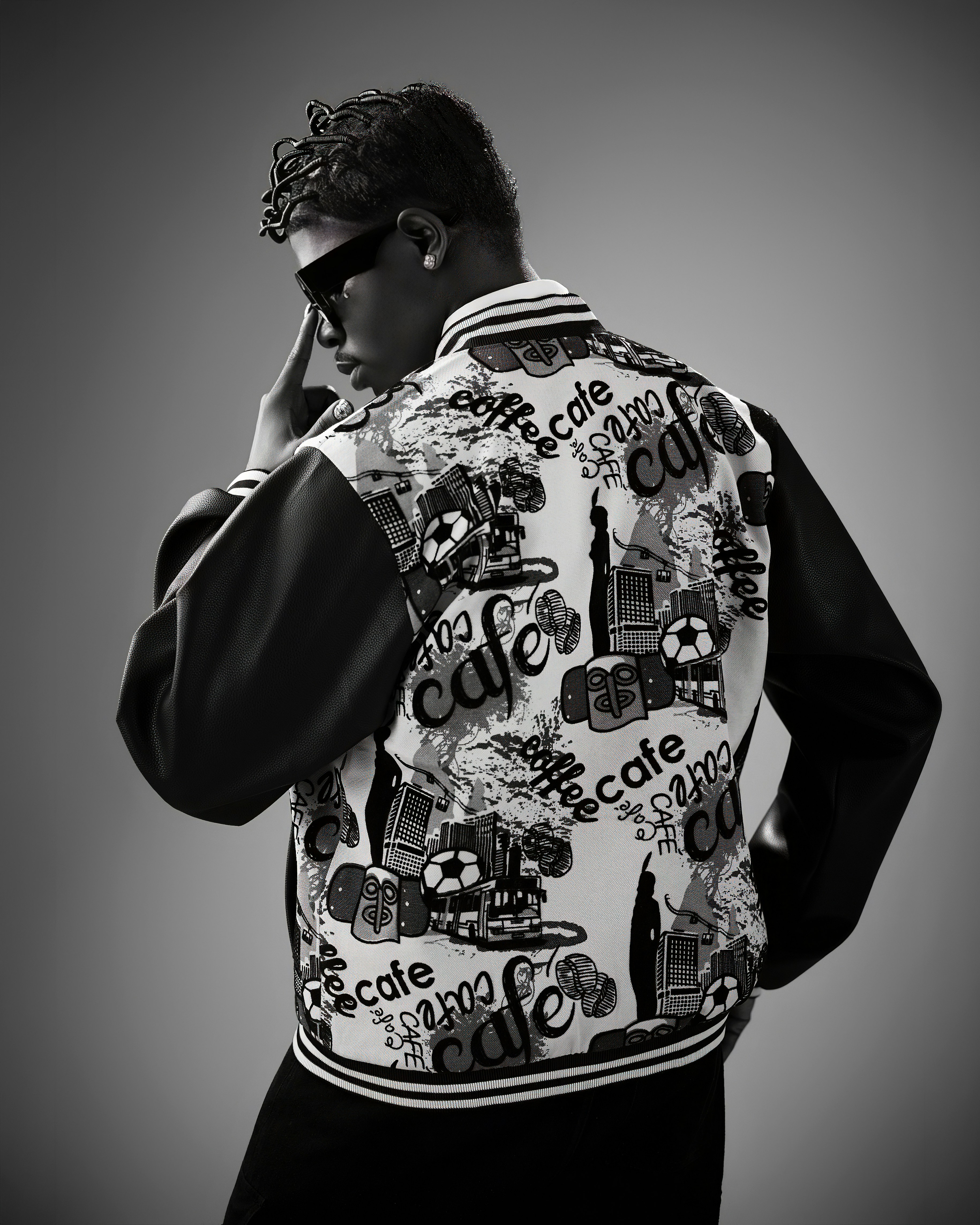 Monochrome Rebel: A Fashion Portrait in Patterned Flight
