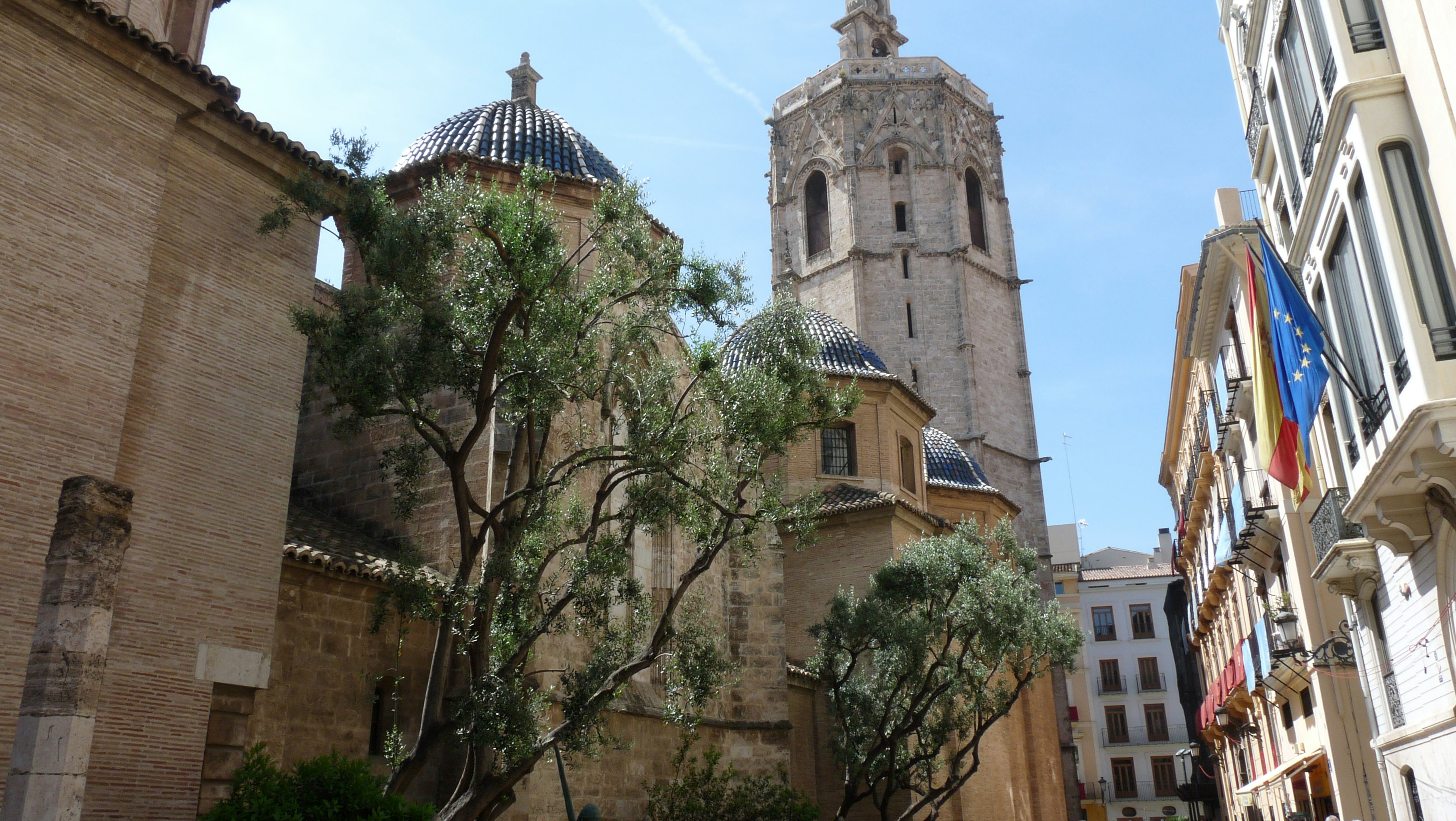 Towering Cathedral and Sunlit Calle in Warm Mediterranean Light