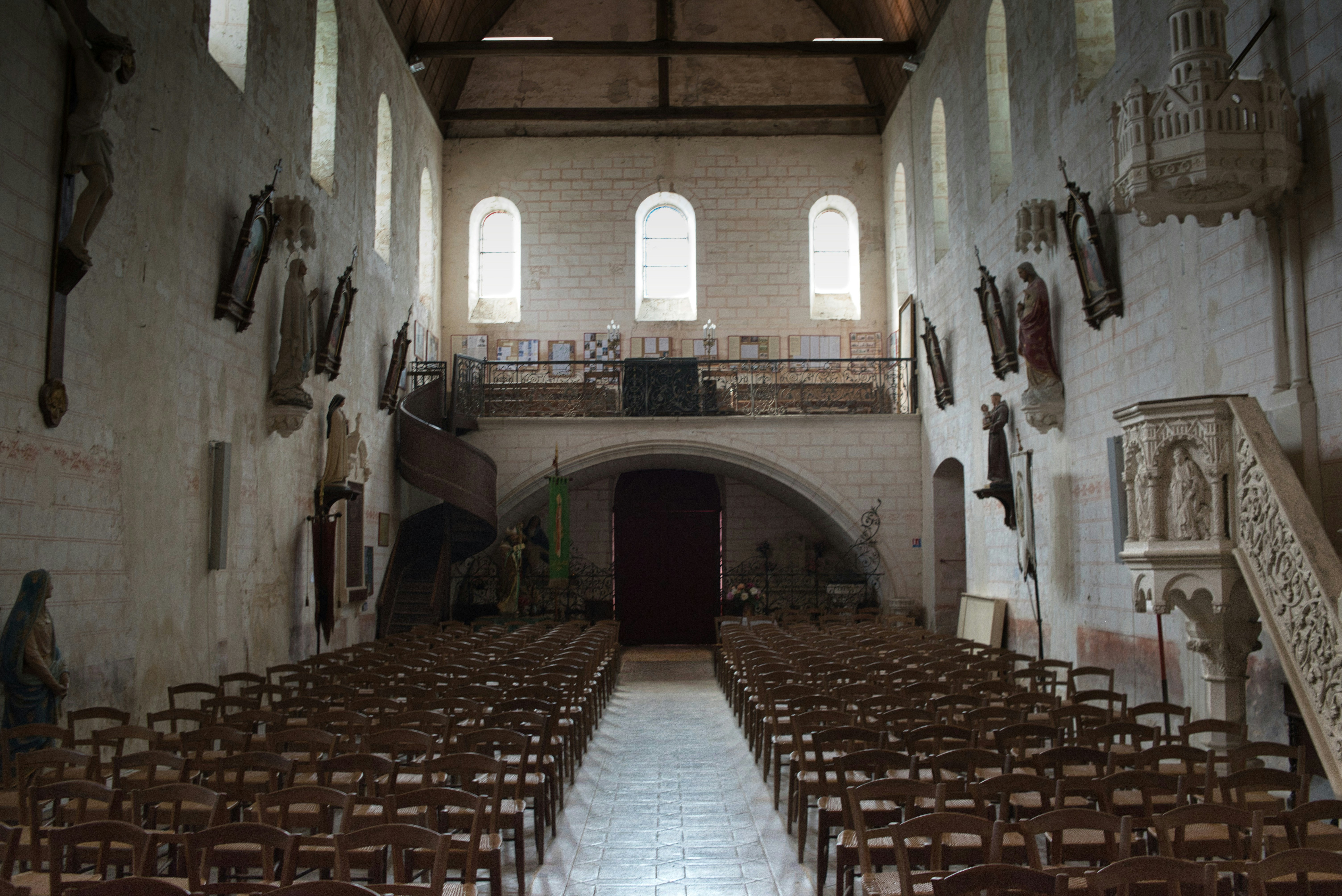 Stone Aisle of Echoes: An Empty Church Ready for Carved Silence