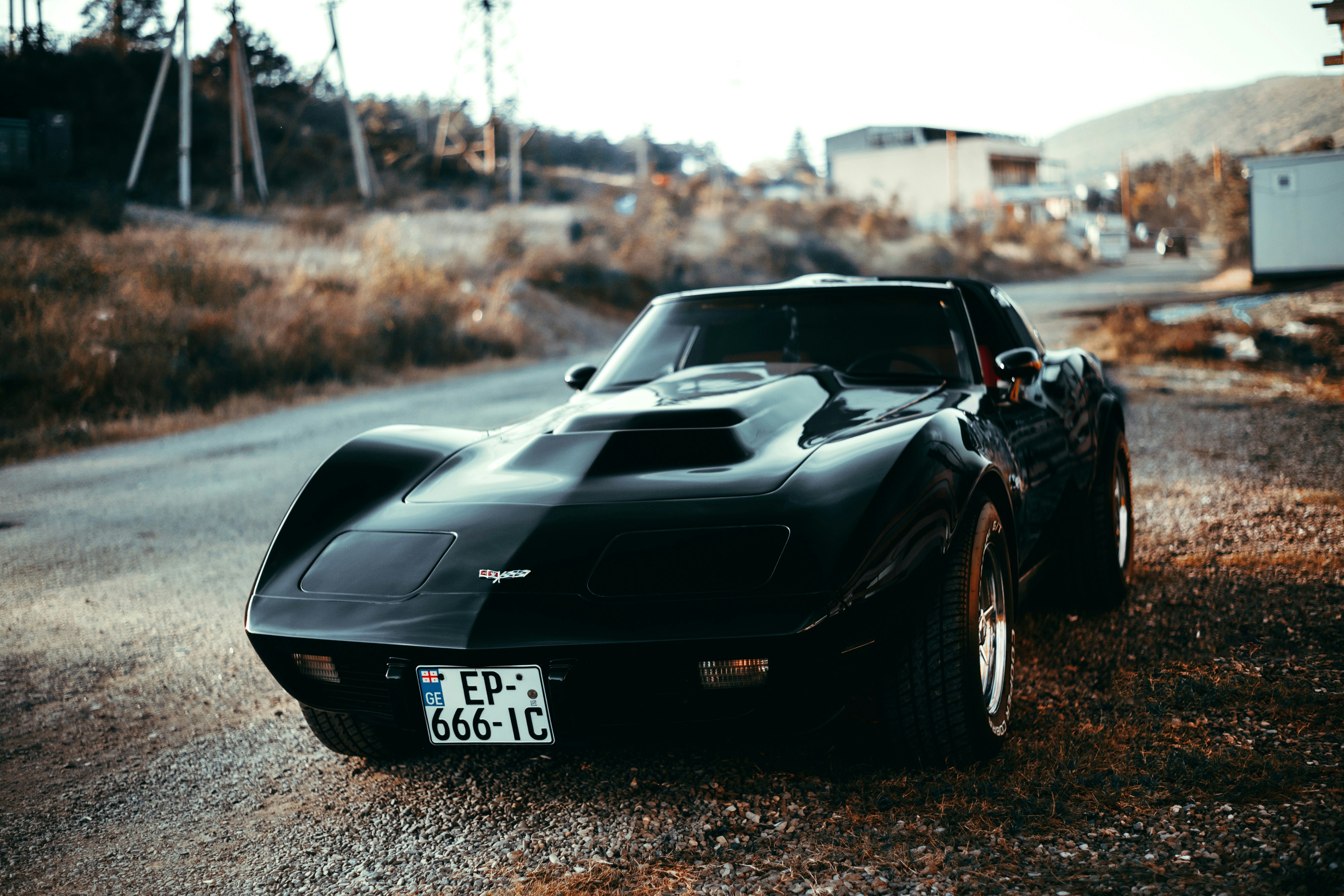 Midday Drift: A Glossy Camaro Resting on a Desert Road