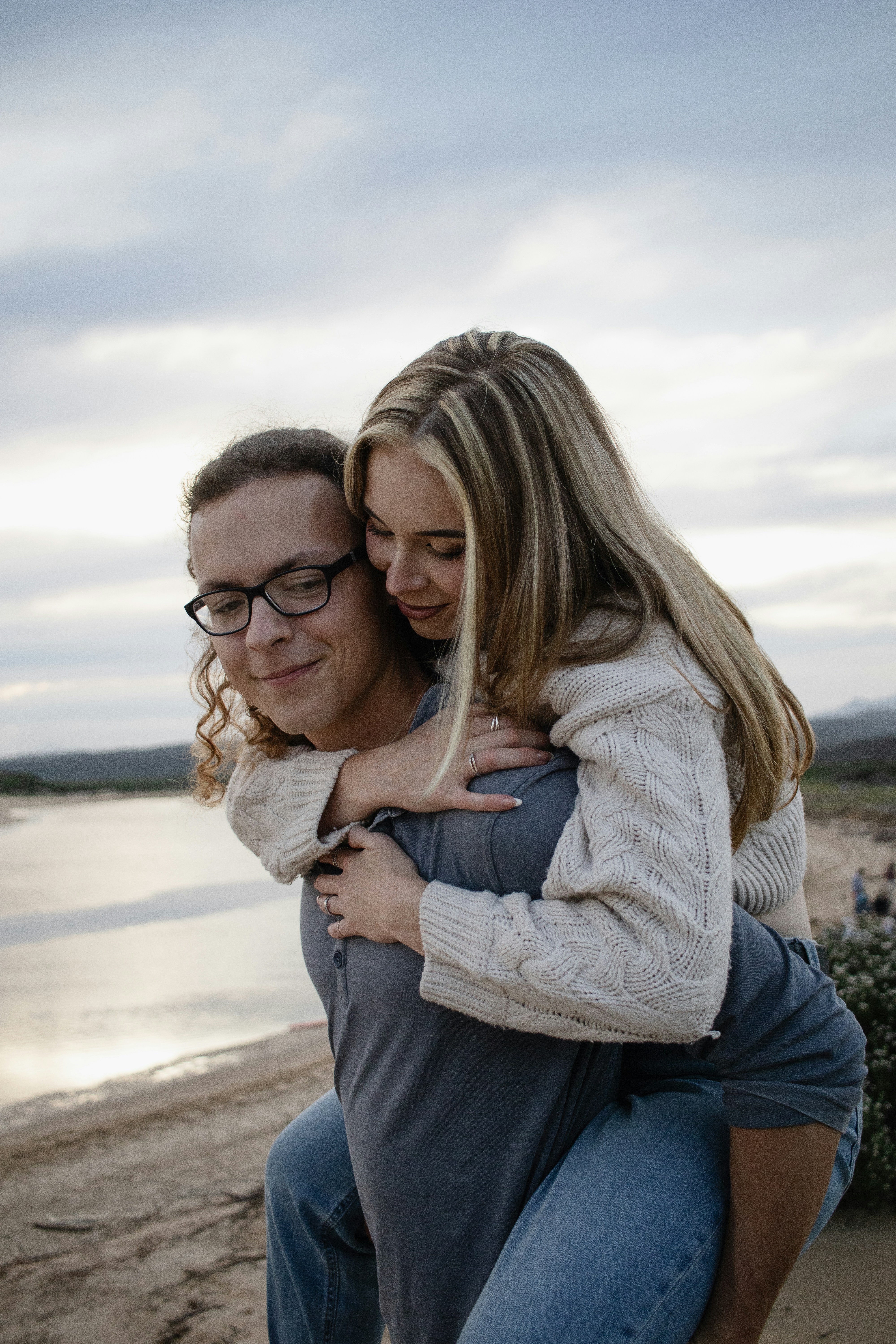 Embrace by the Shore: A Quiet Moment of Togetherness