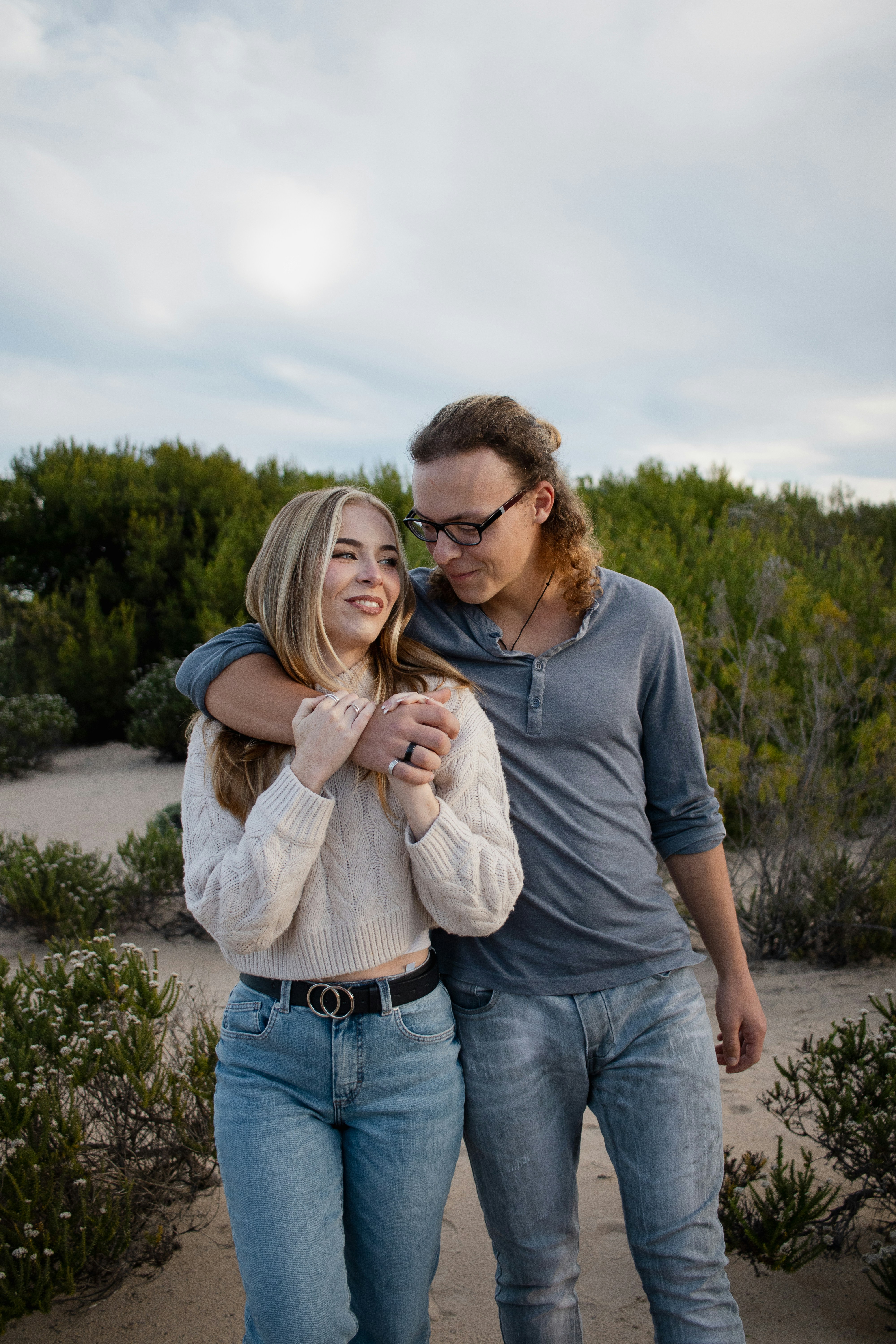 Embrace in the Sand: A Quiet Moment Between Two