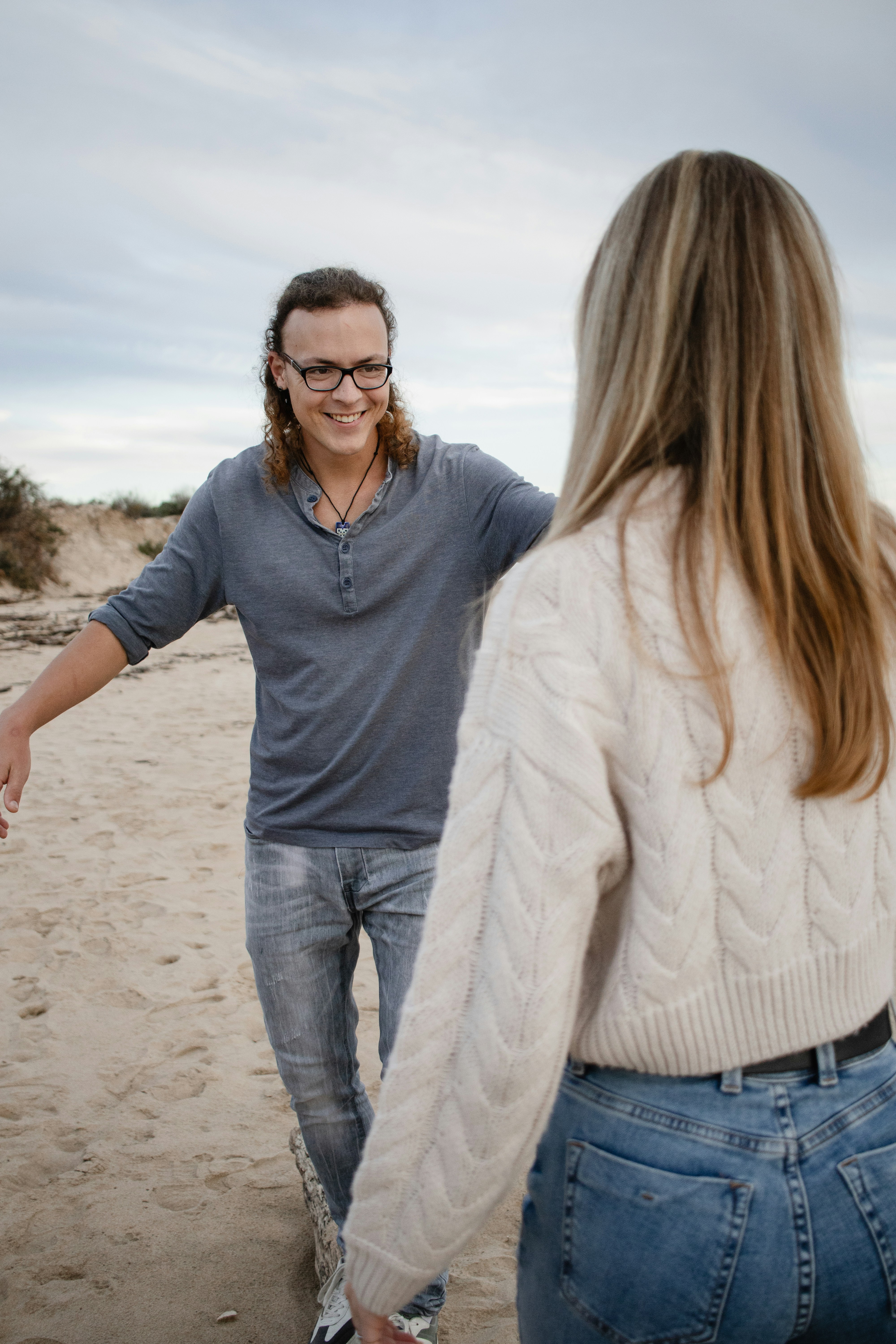 Two Friends at the Dune Edge: A Beach Encounter in Soft Light