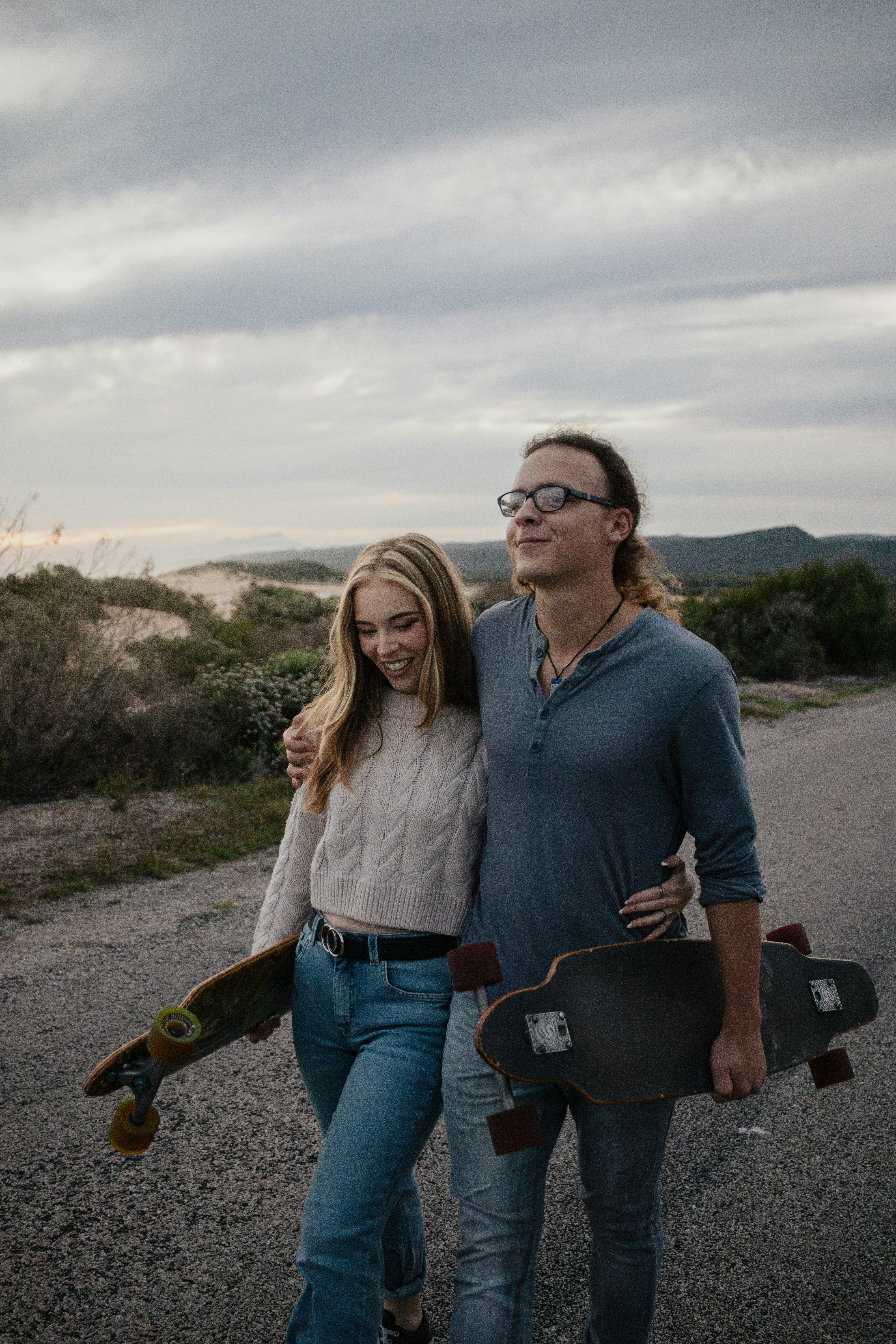 Two Amigos on a Dune-Edge Sunset Walk with Skateboards