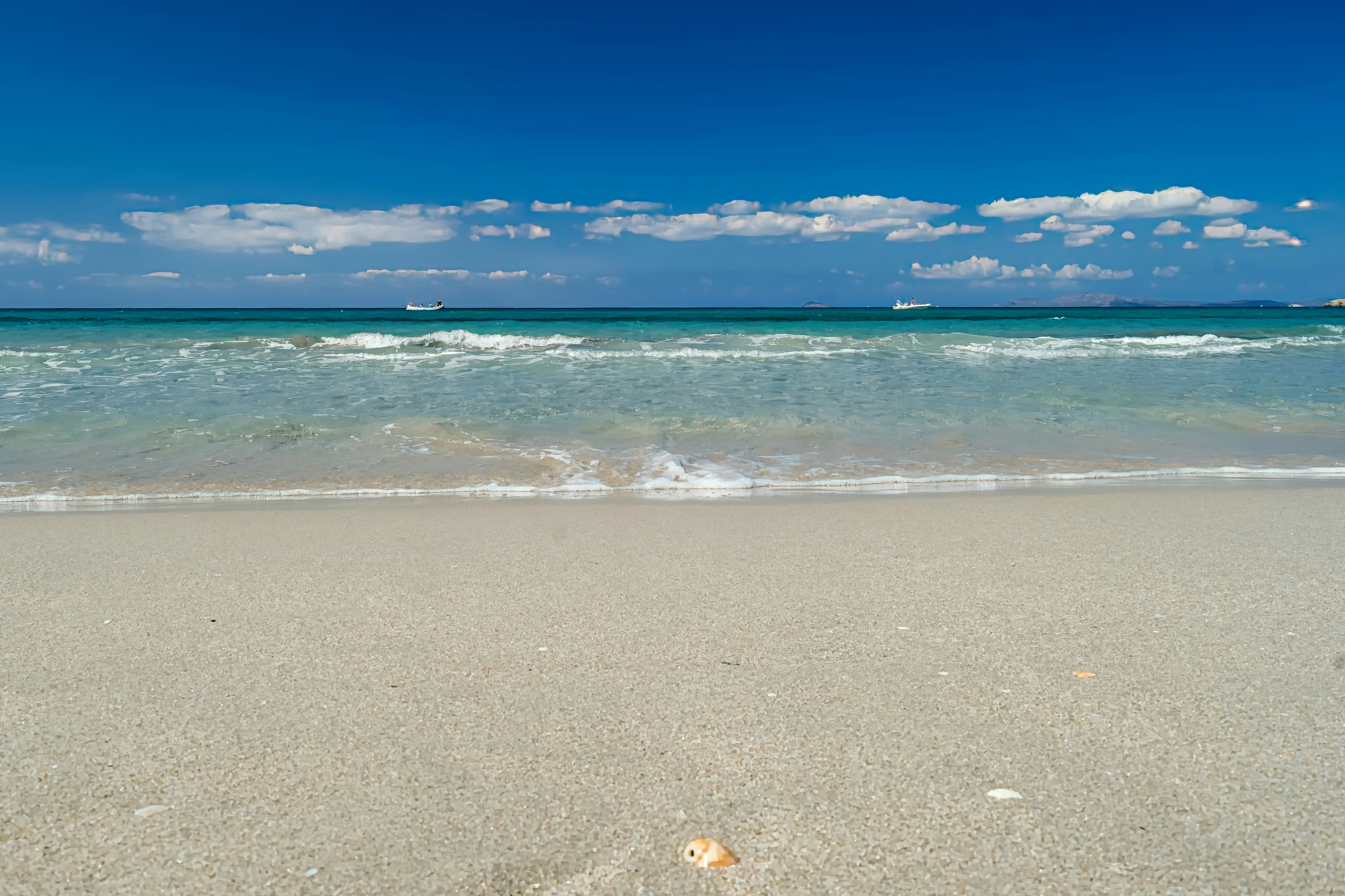 Horizon Whisper: Sunlit Sandmeet Sea at Noon