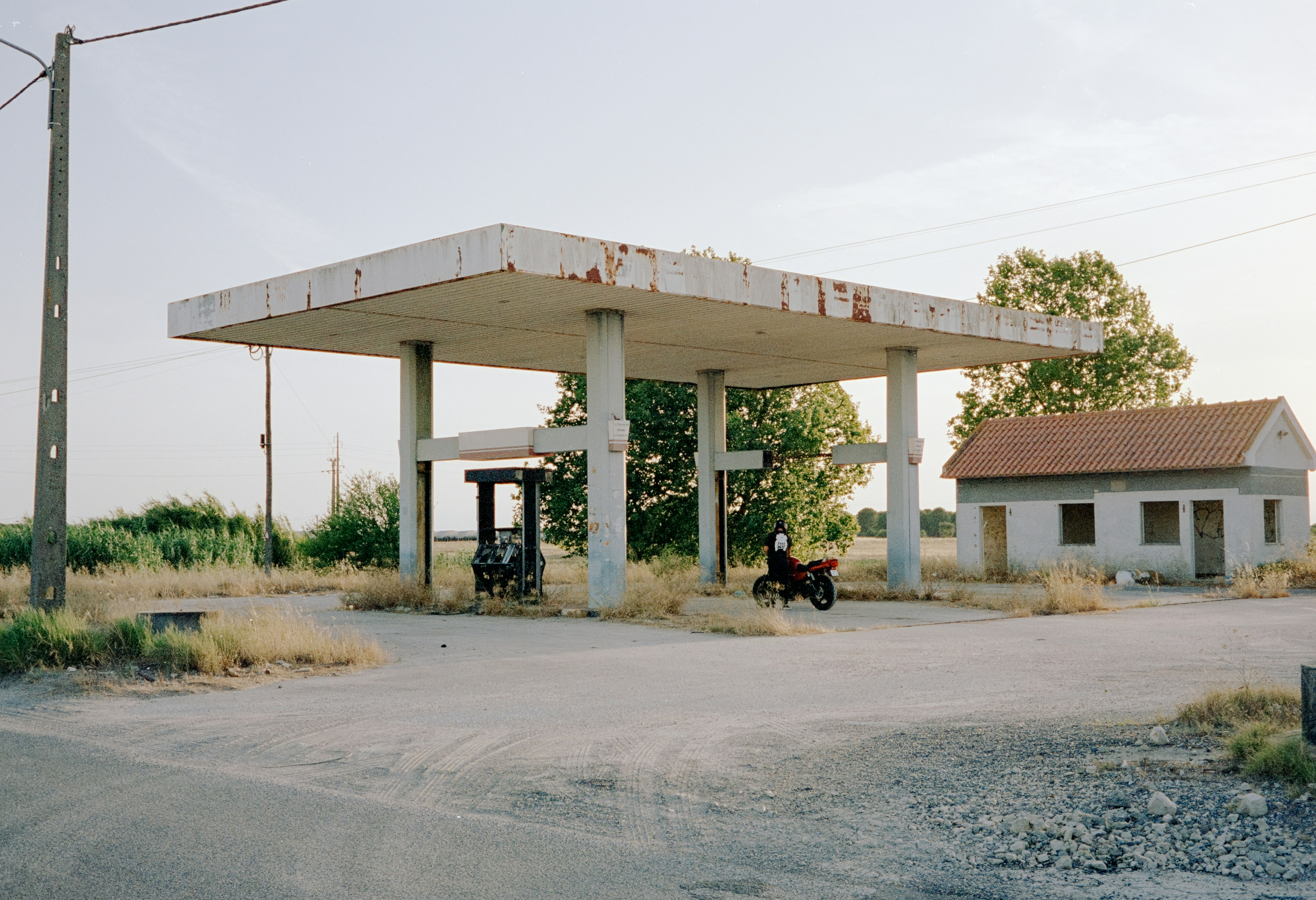 Deserted Fuel Stop Under a Rusting Canopy