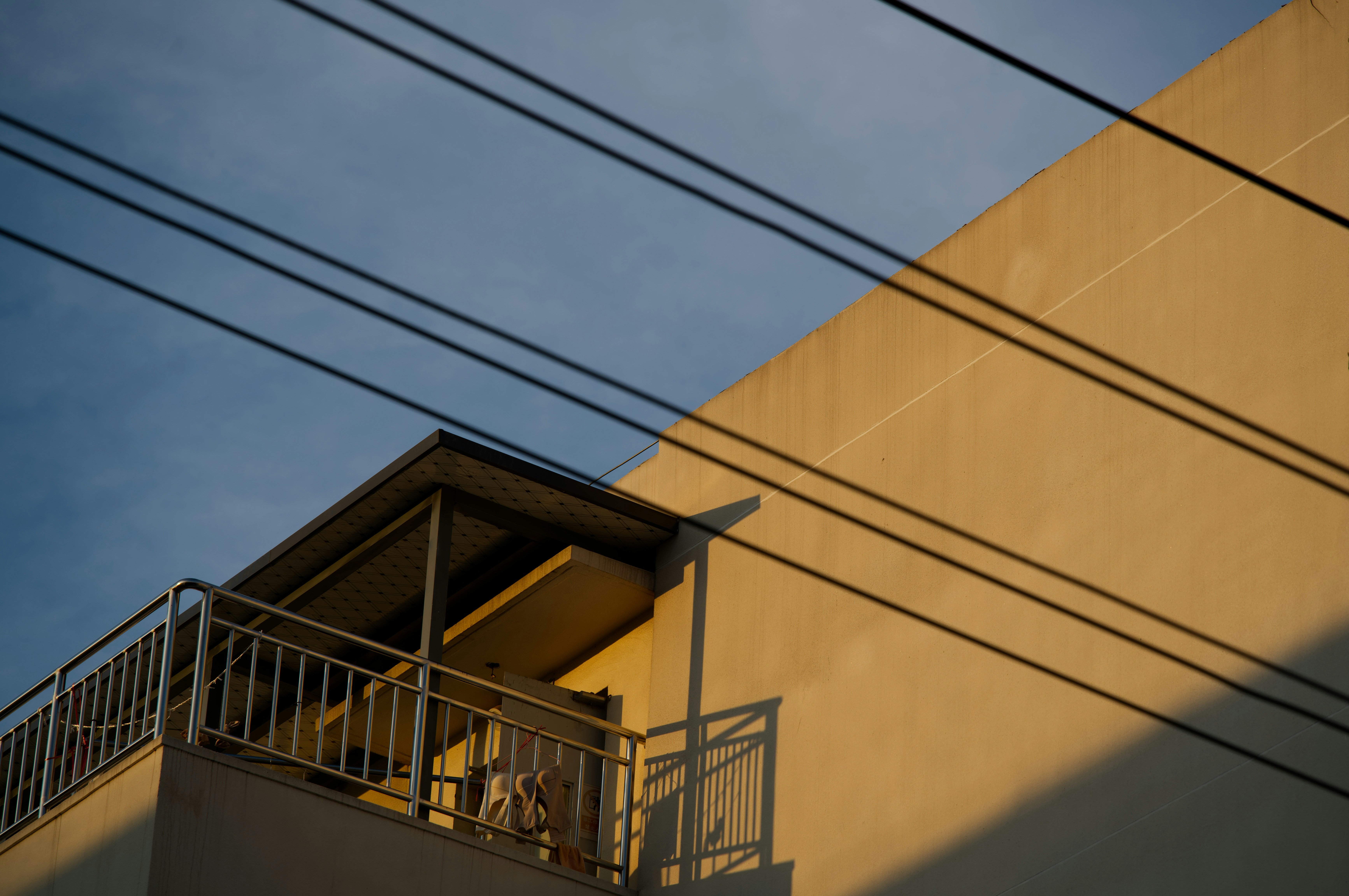 Sunlit Balcony Geometry under Diagonal Power Lines