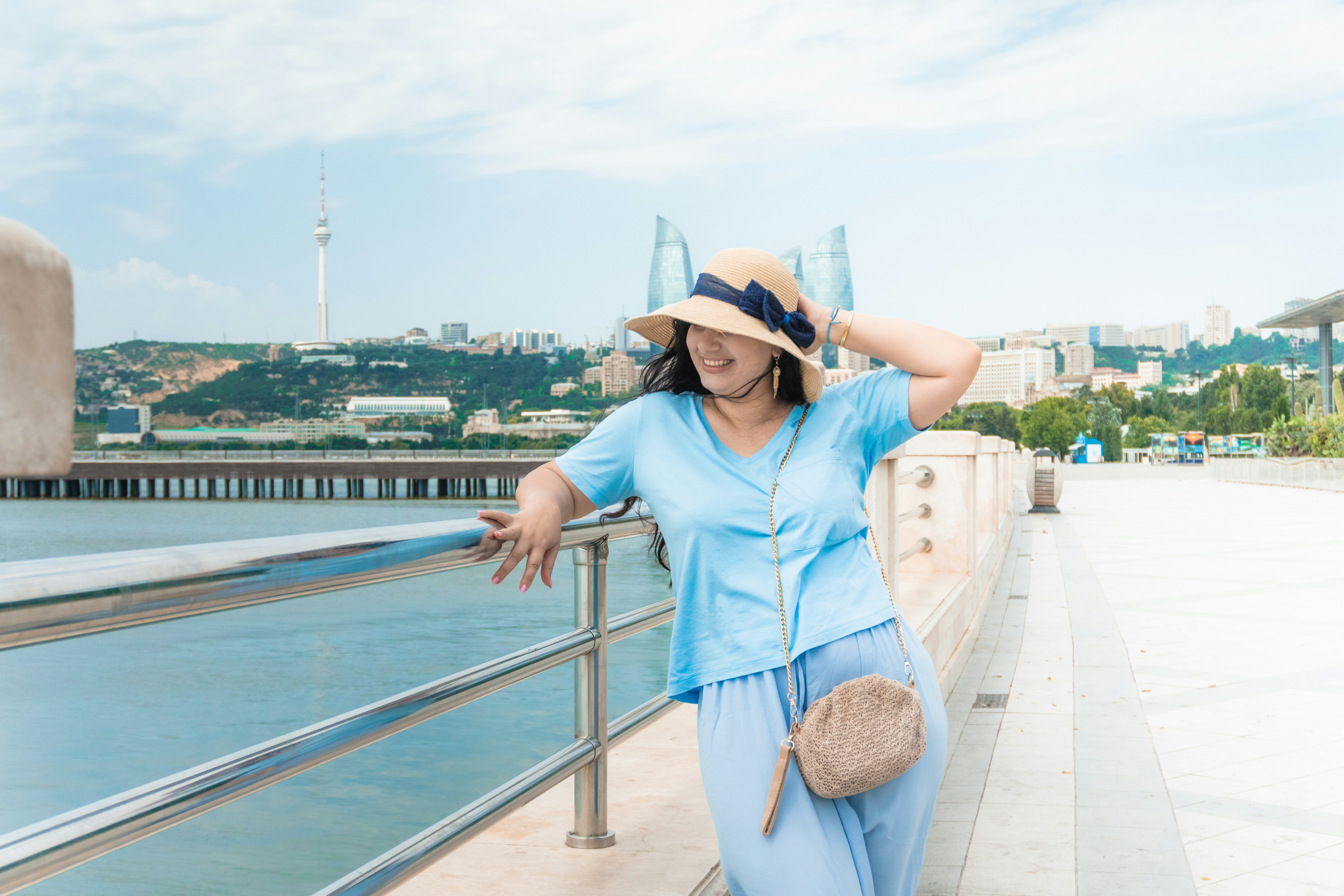 Coastal Stroll Under Sunshine with a Wide-Brim Charm