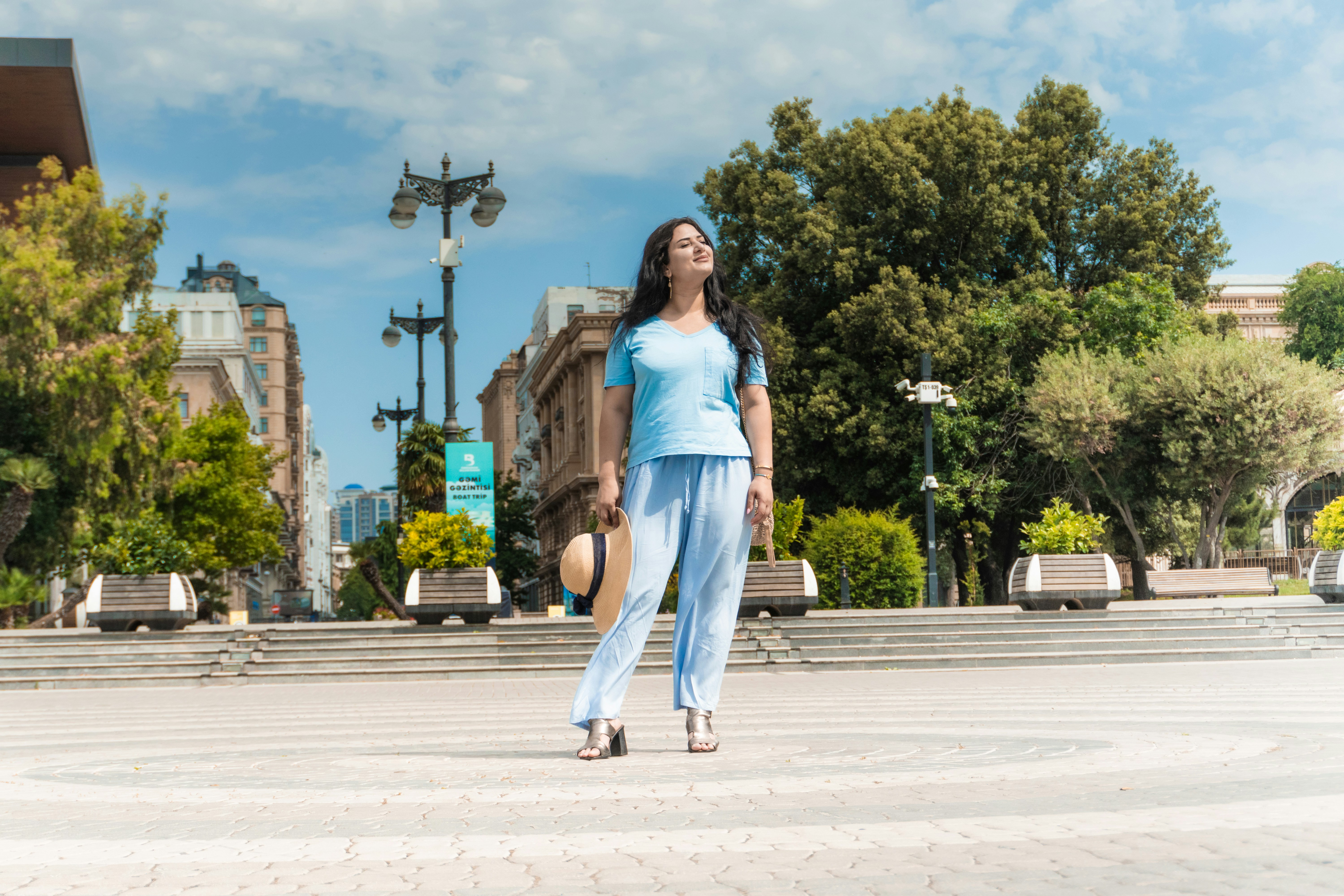 Blue Ensemble in a City Square: A Confident Stride