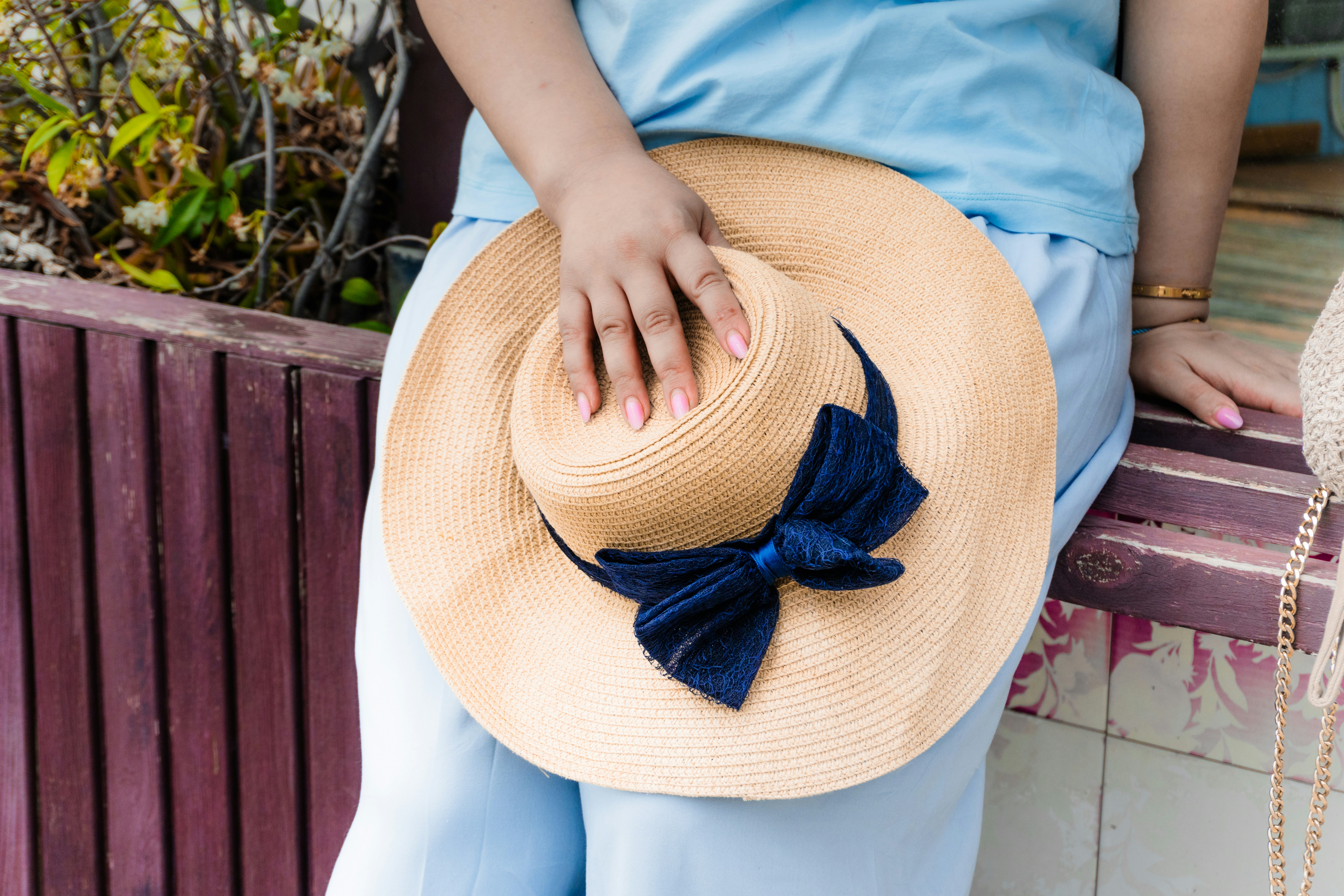 Blue Ensemble and Straw Hat: Quiet Moment on the Veranda