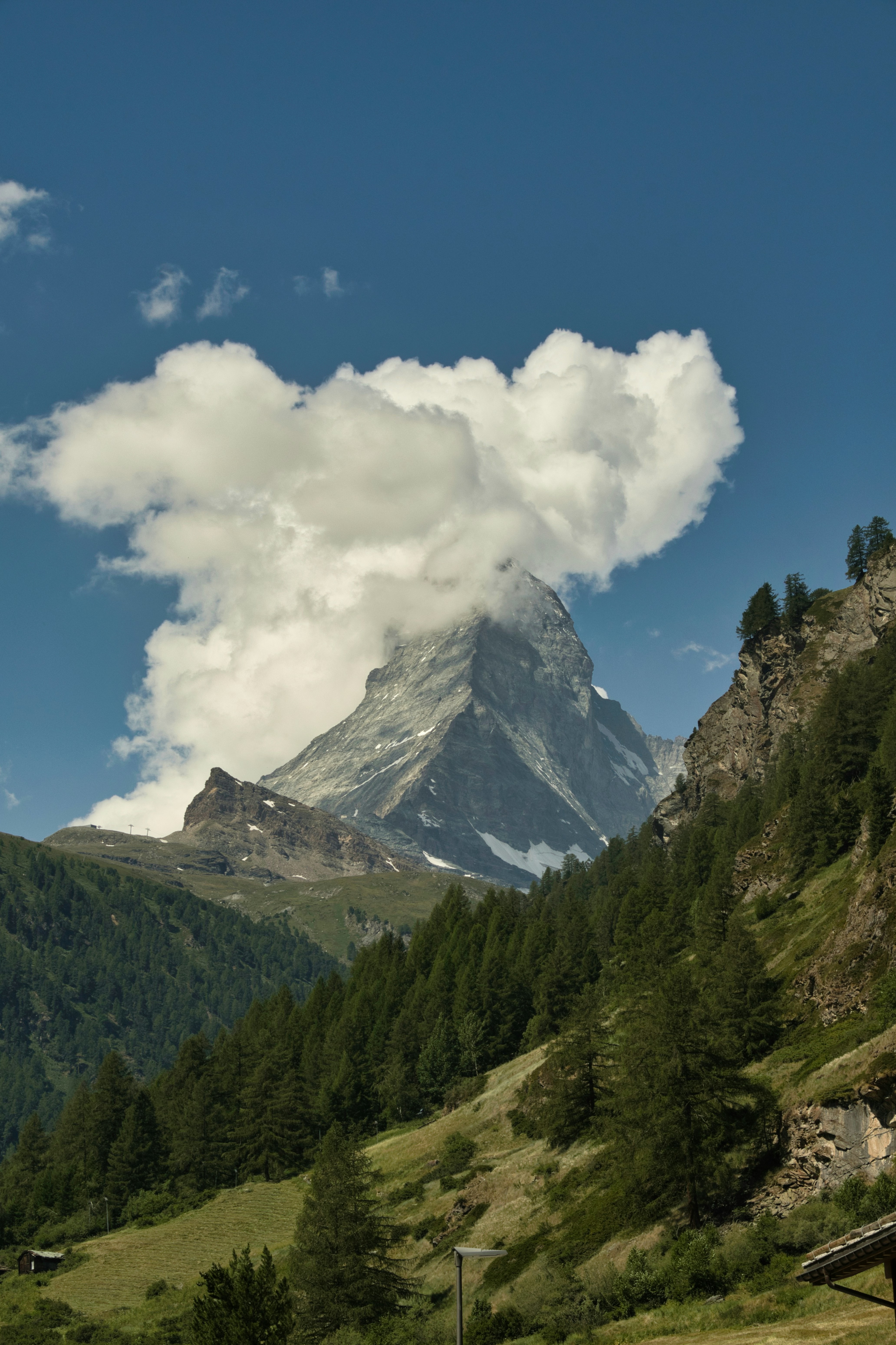 Cloud-nosed Peak: A Mountain Framed by Verdant Slopes