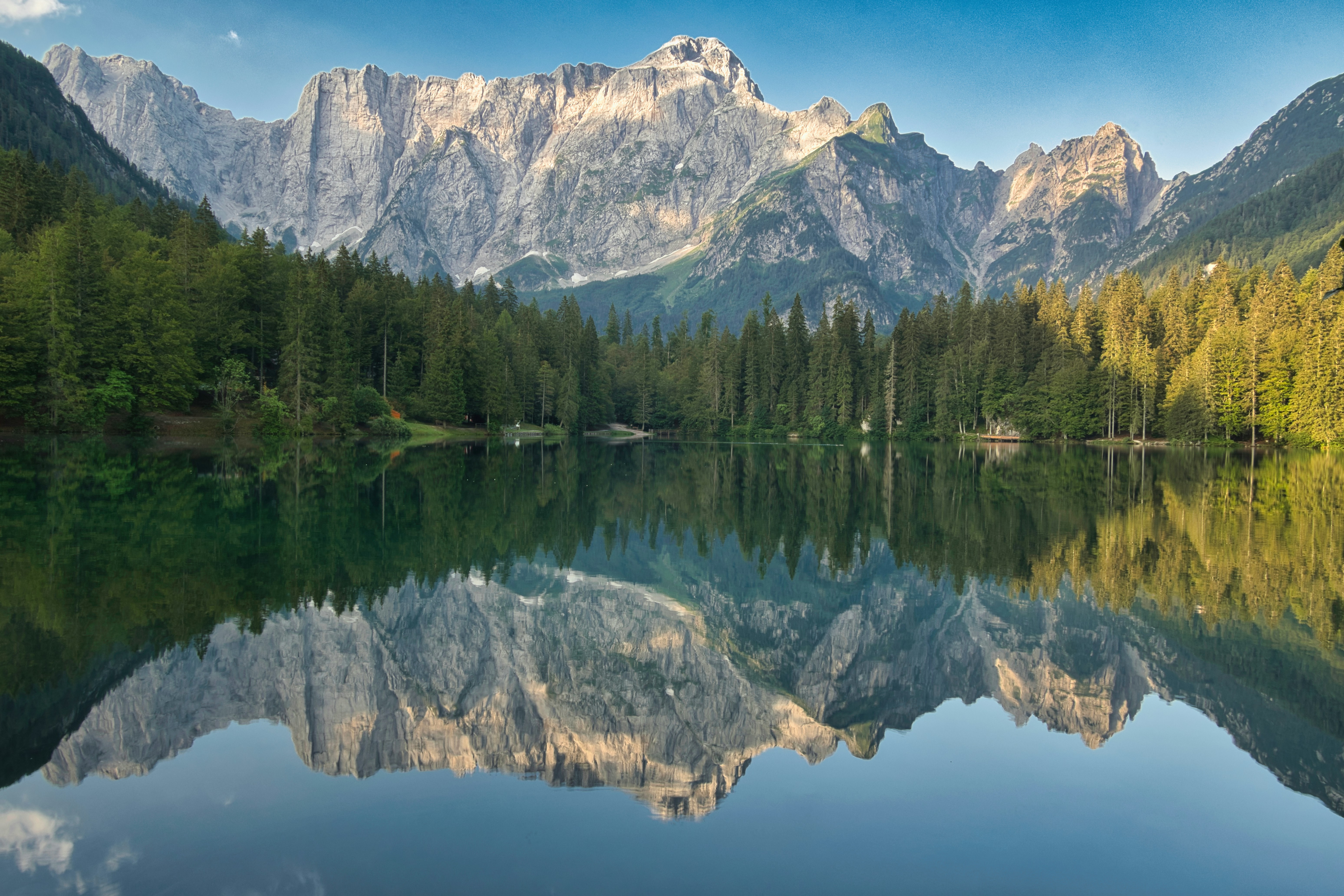 Mirror Peaks: Alpine Range Reflects on a Tranquil Lake