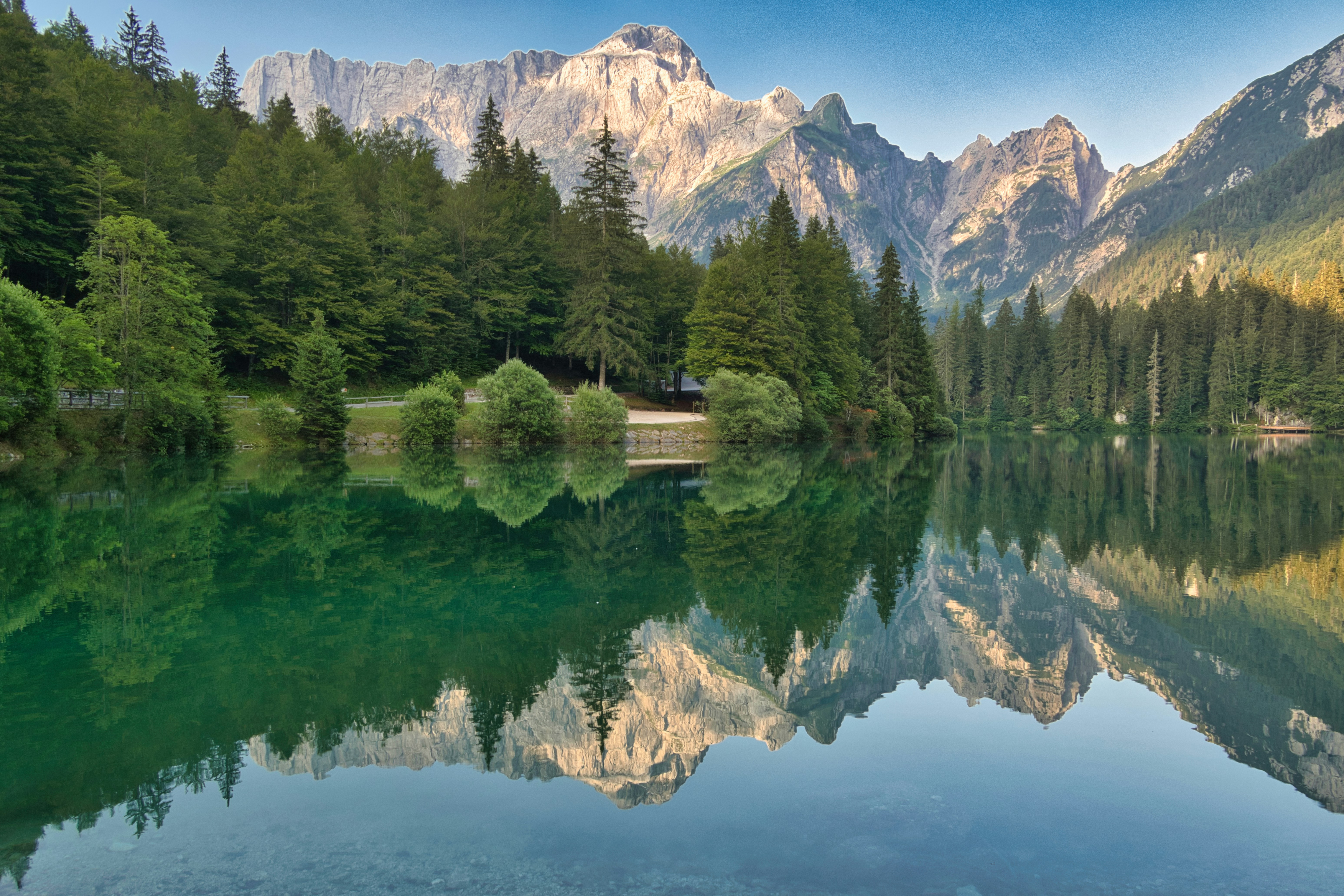 Mirror-Twin Peaks over a Serene Alpine Lake