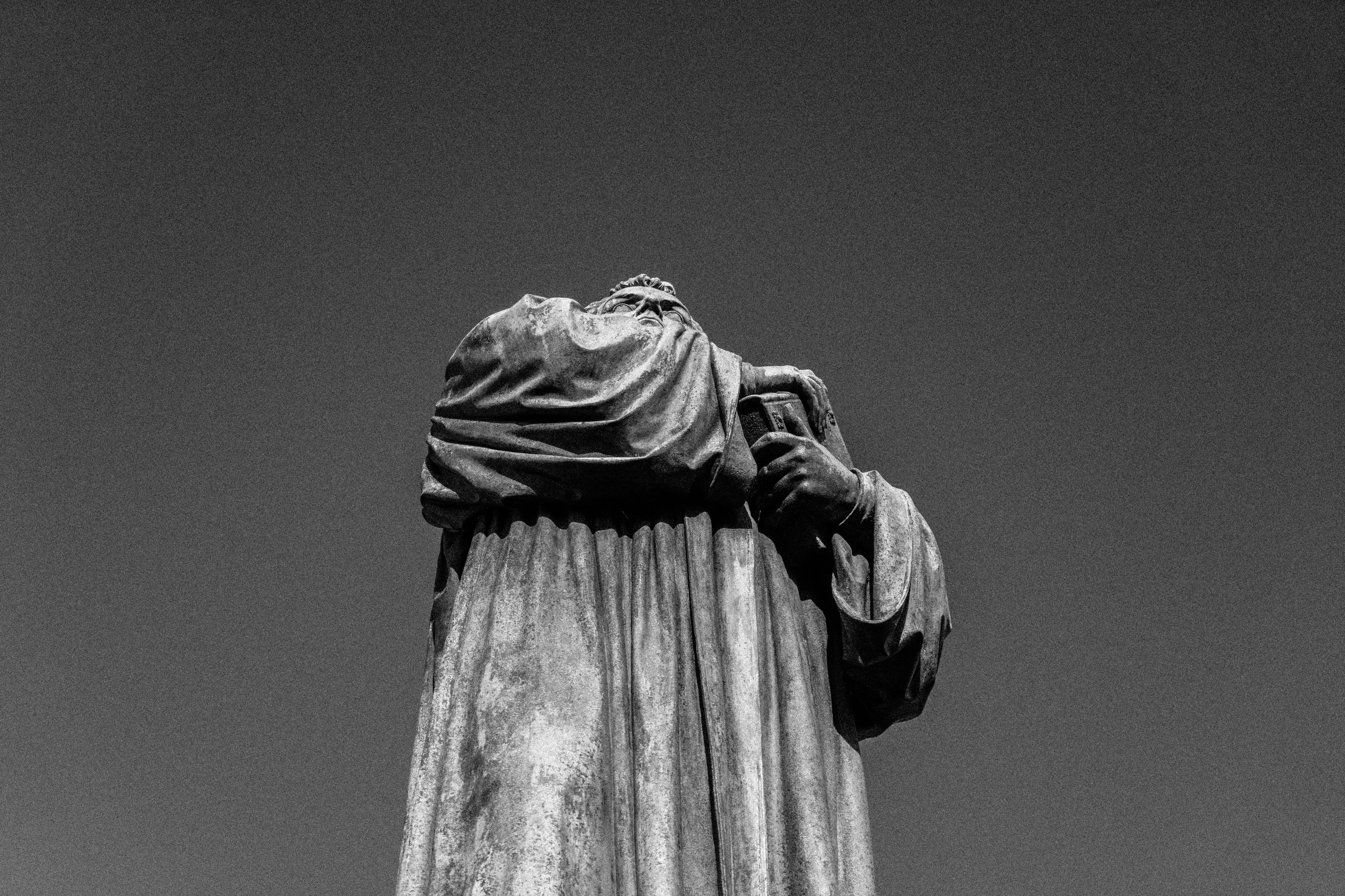 The Veiled Savior: A Shrouded Figure Against the Sky