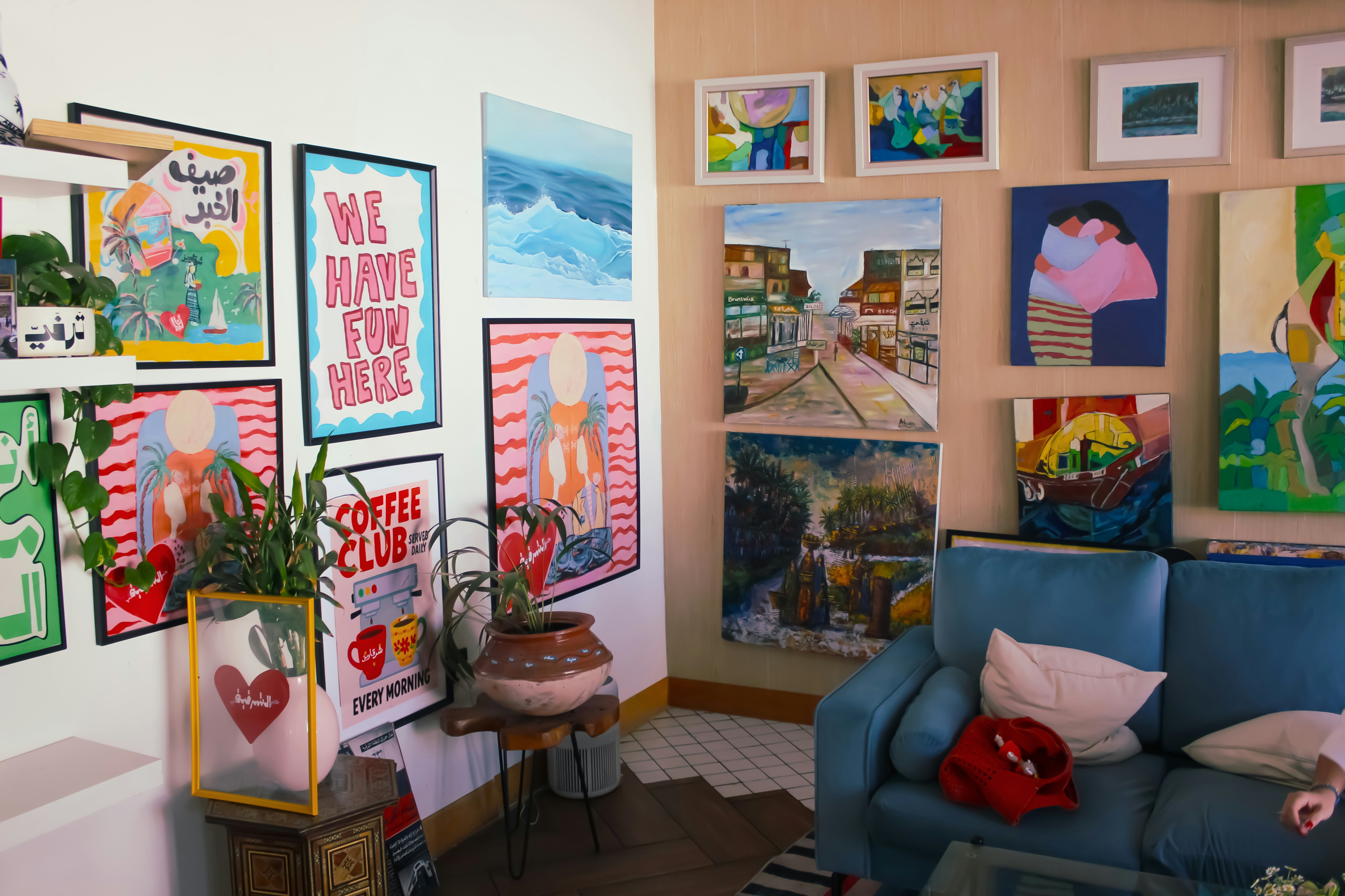 Colorful Gallery Nook: A Cozy Corner Showcasing Vibrant Portraits and Artful Decor