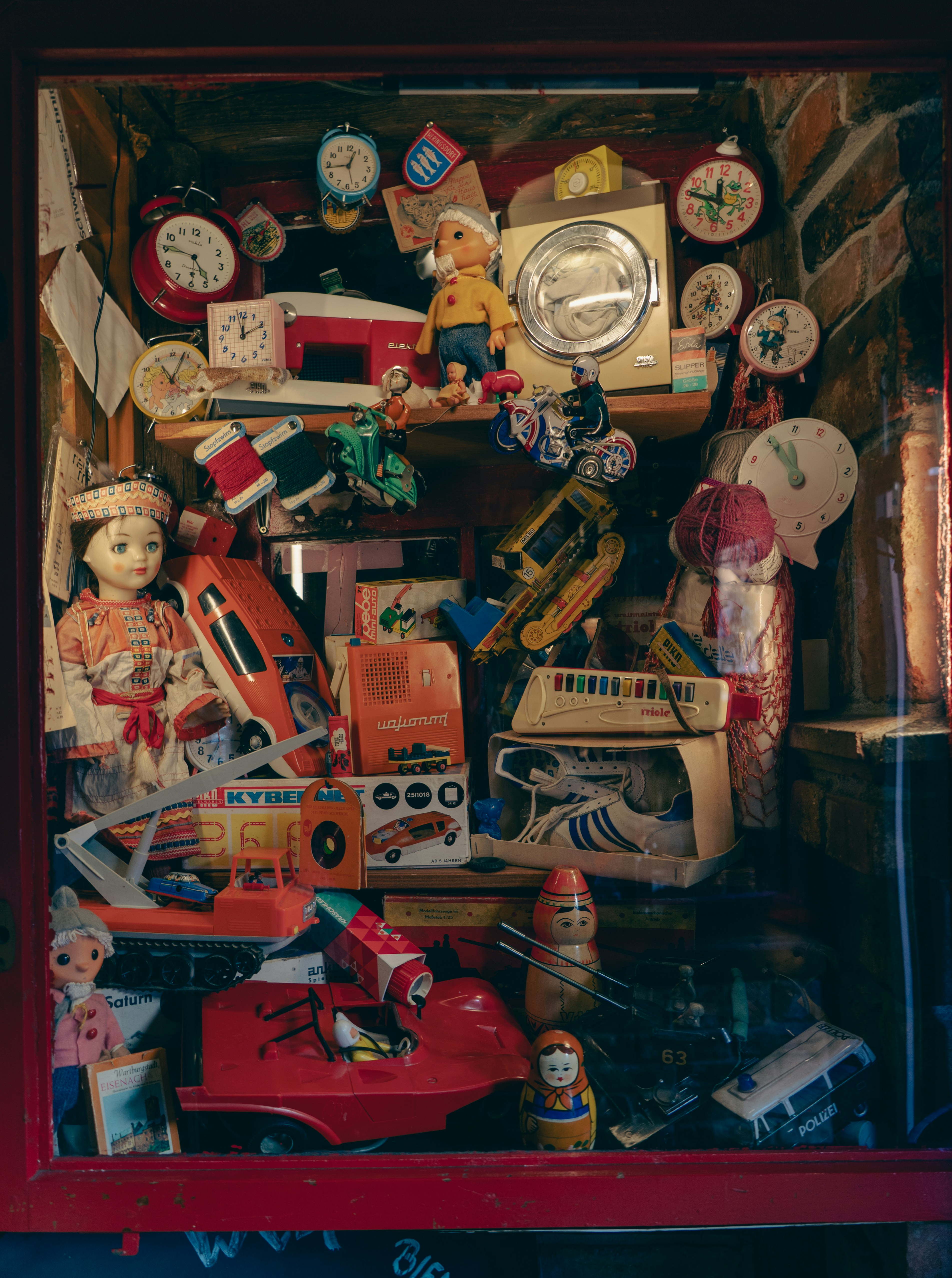 Toy Cabinet Time Capsule: A Cluttered Shelf of Nostalgia