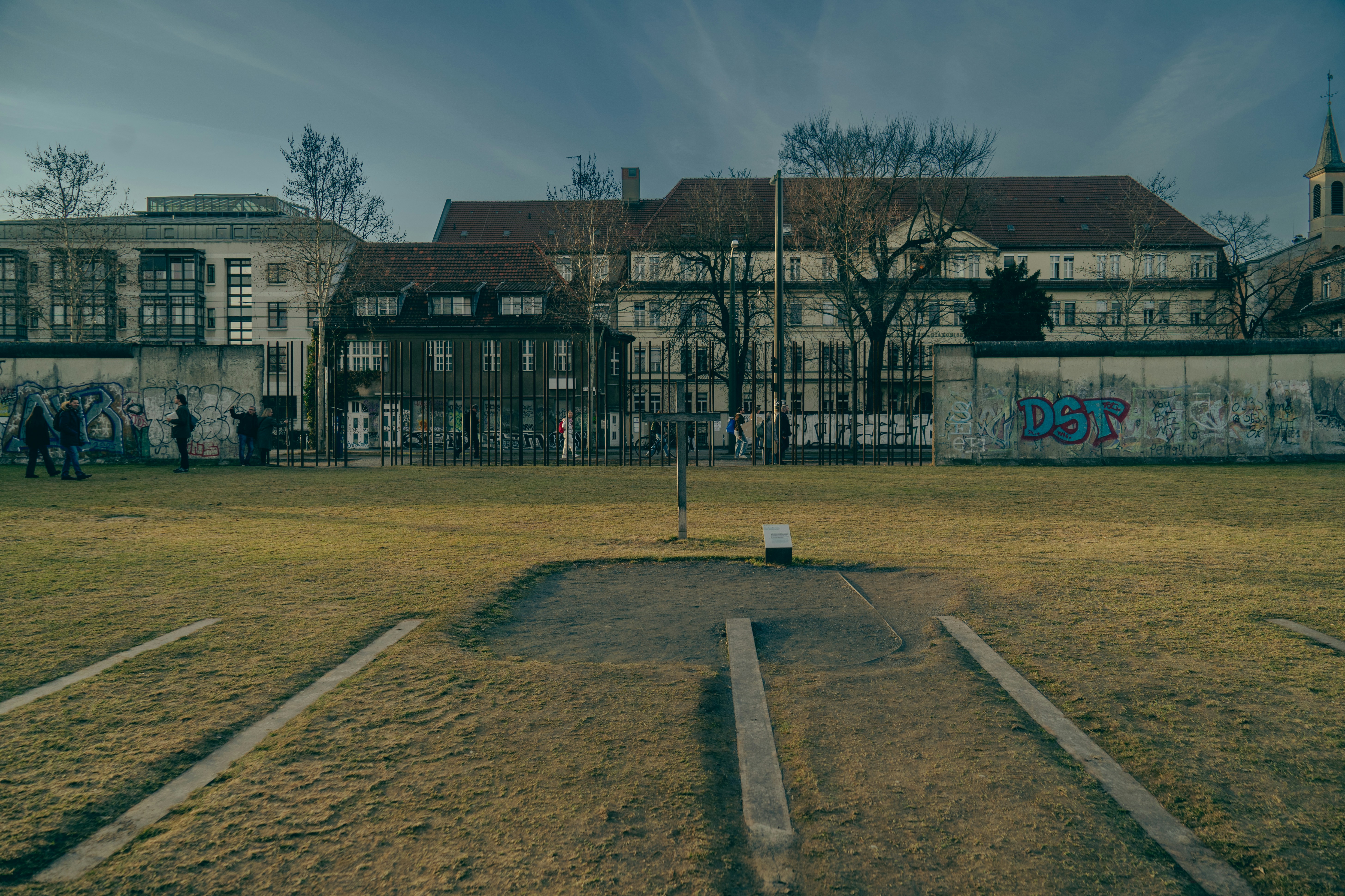 Central Lawn with Boundary Wall and Distant Cityscape