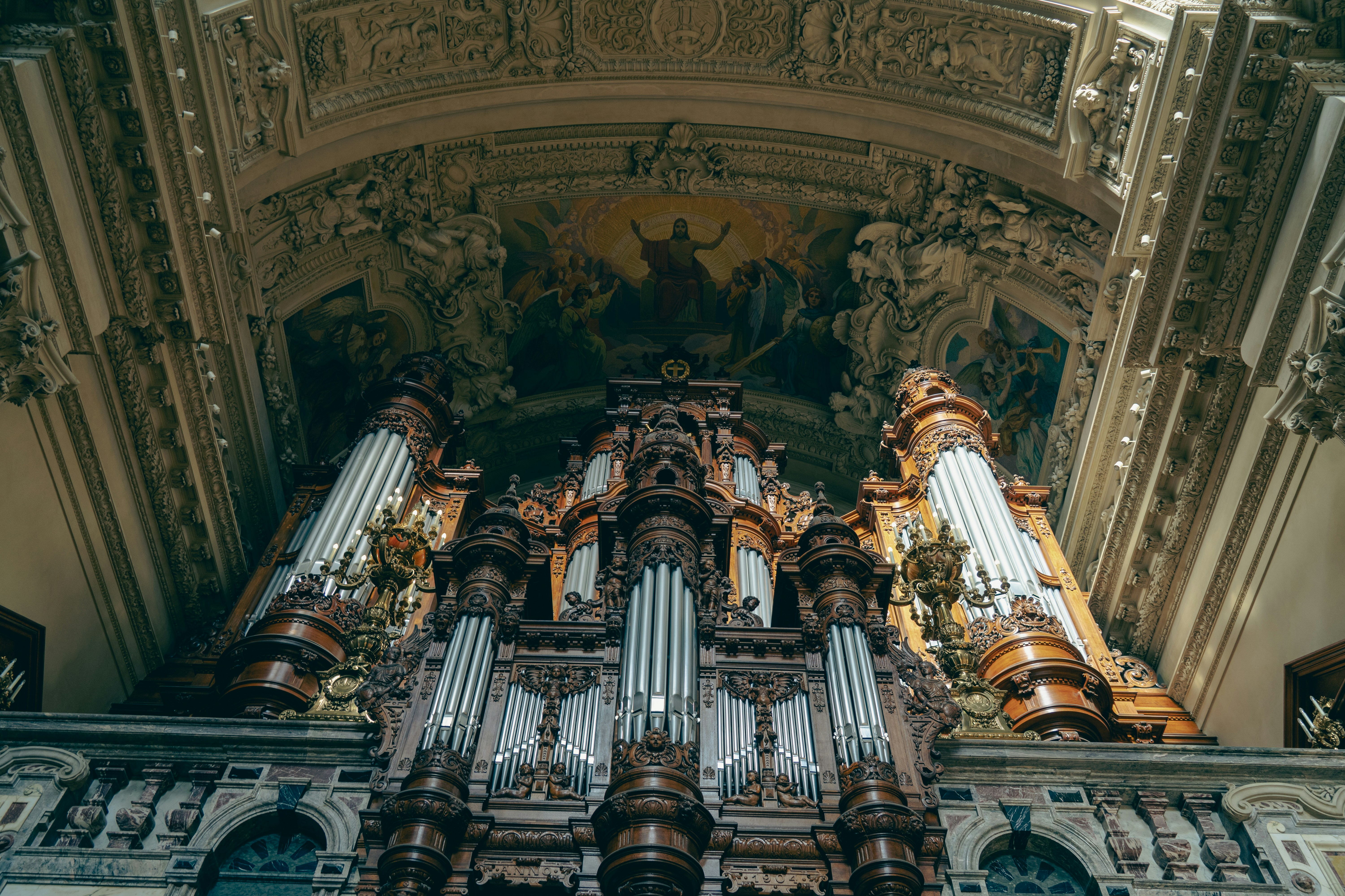 Ornate Pipe Organ Archway Reaching Toward a Painted Ceiling