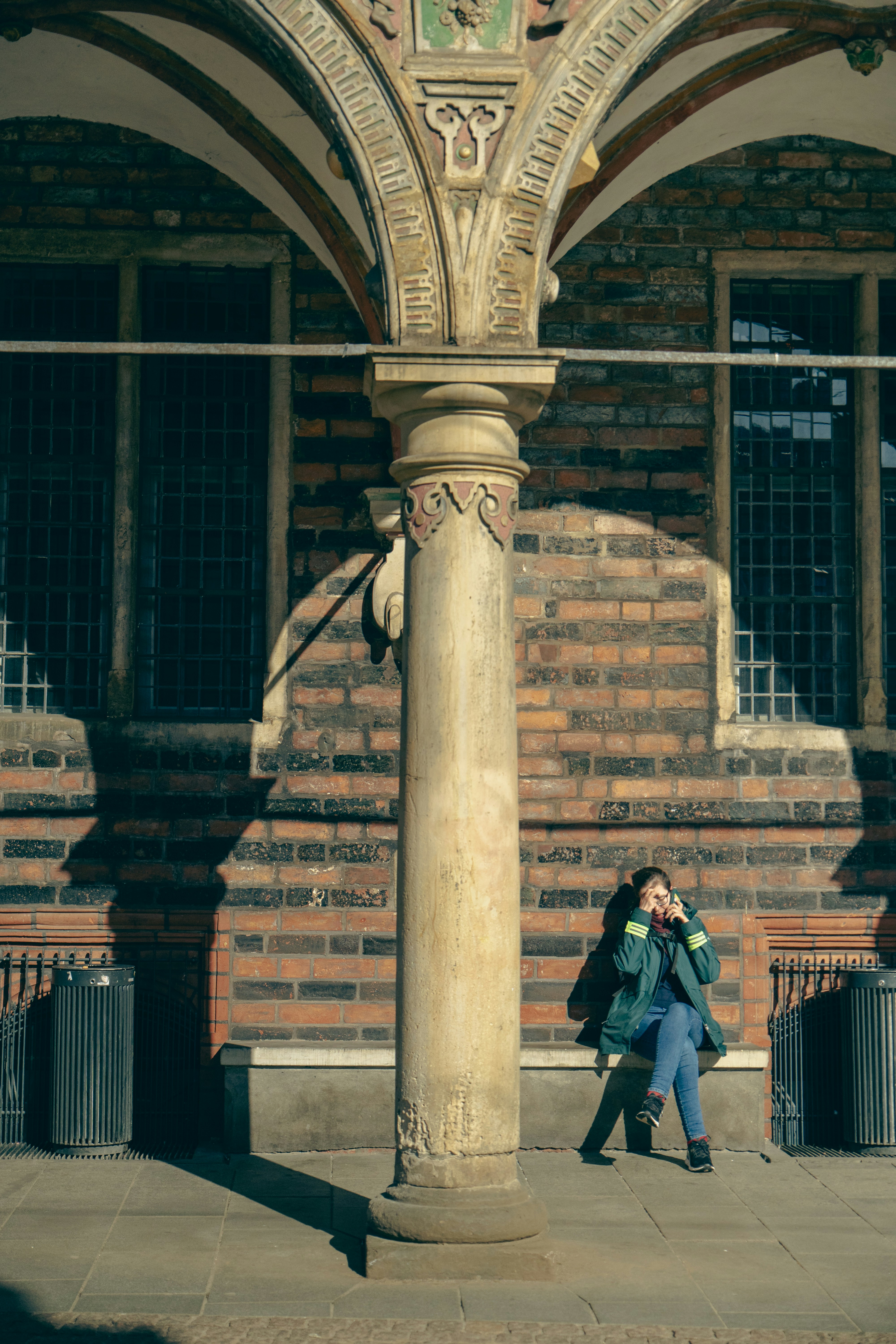 Portrait in the Colonnade: A Quiet Moment with Urban Architecture