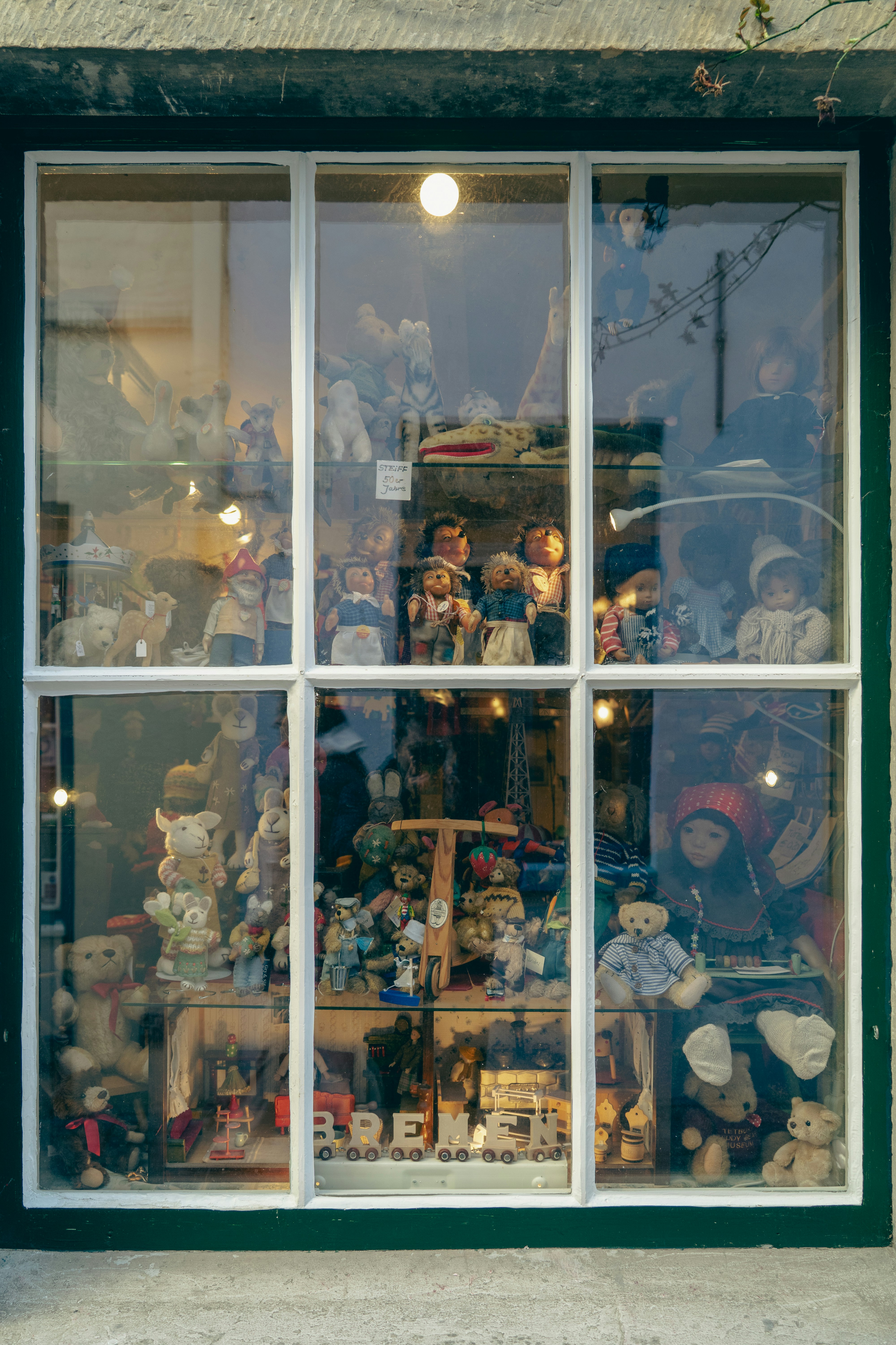 Curio Shop Window: A Warm Parade of Plush and Dolls