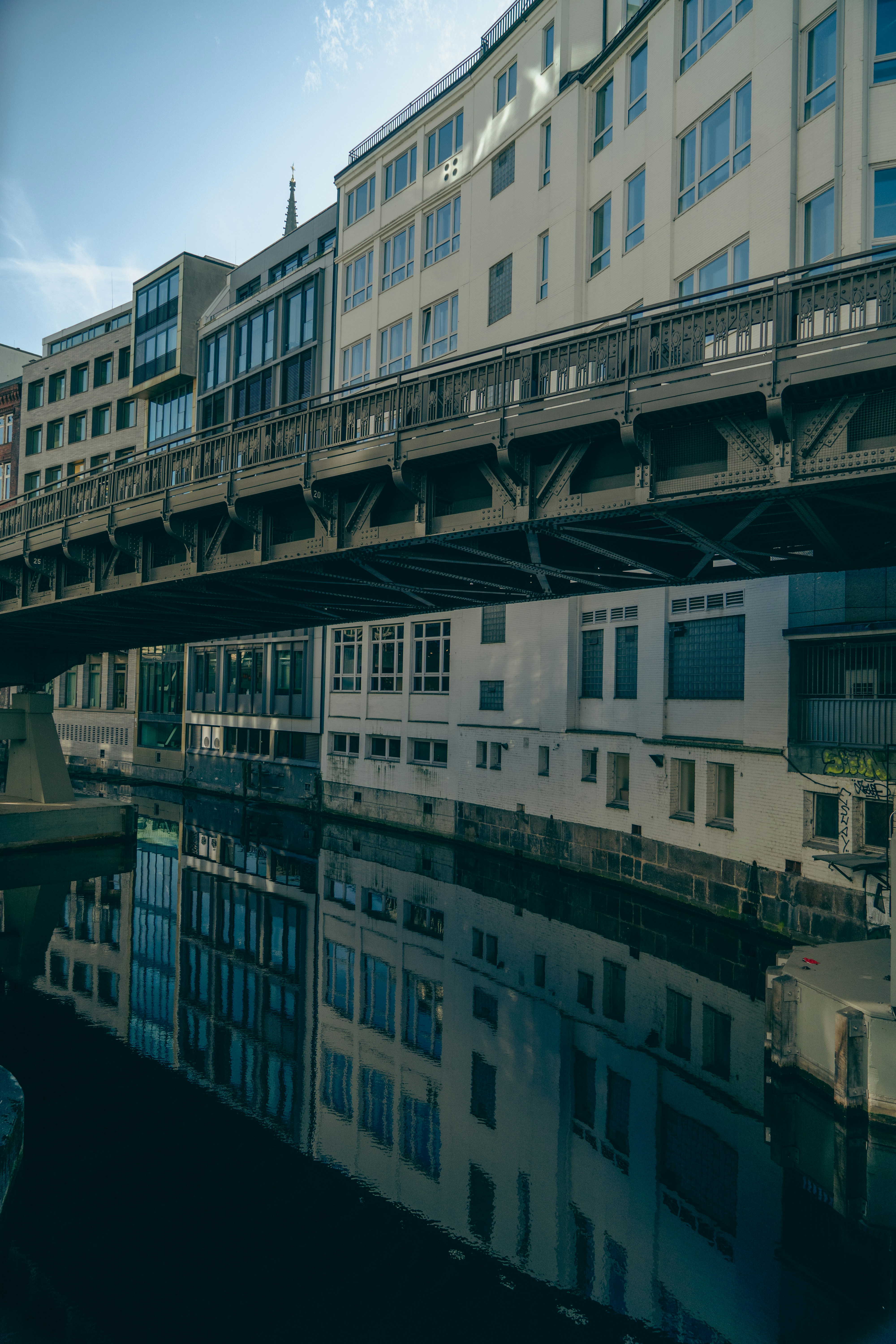 Reflections Under a Rail Bridge: Urban Waterfront