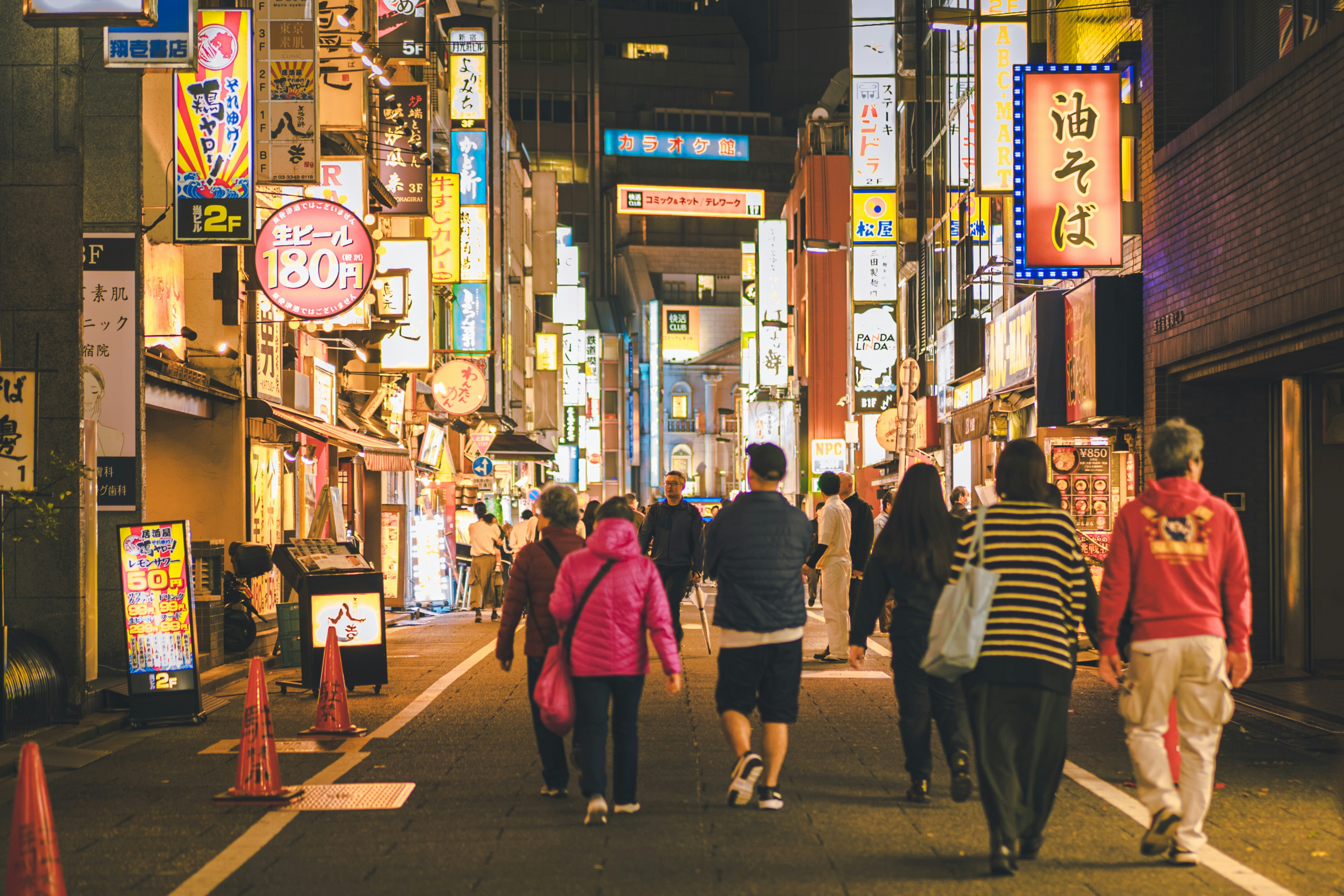  Neon Alleyway: Pedestrians under City Lighted Signs