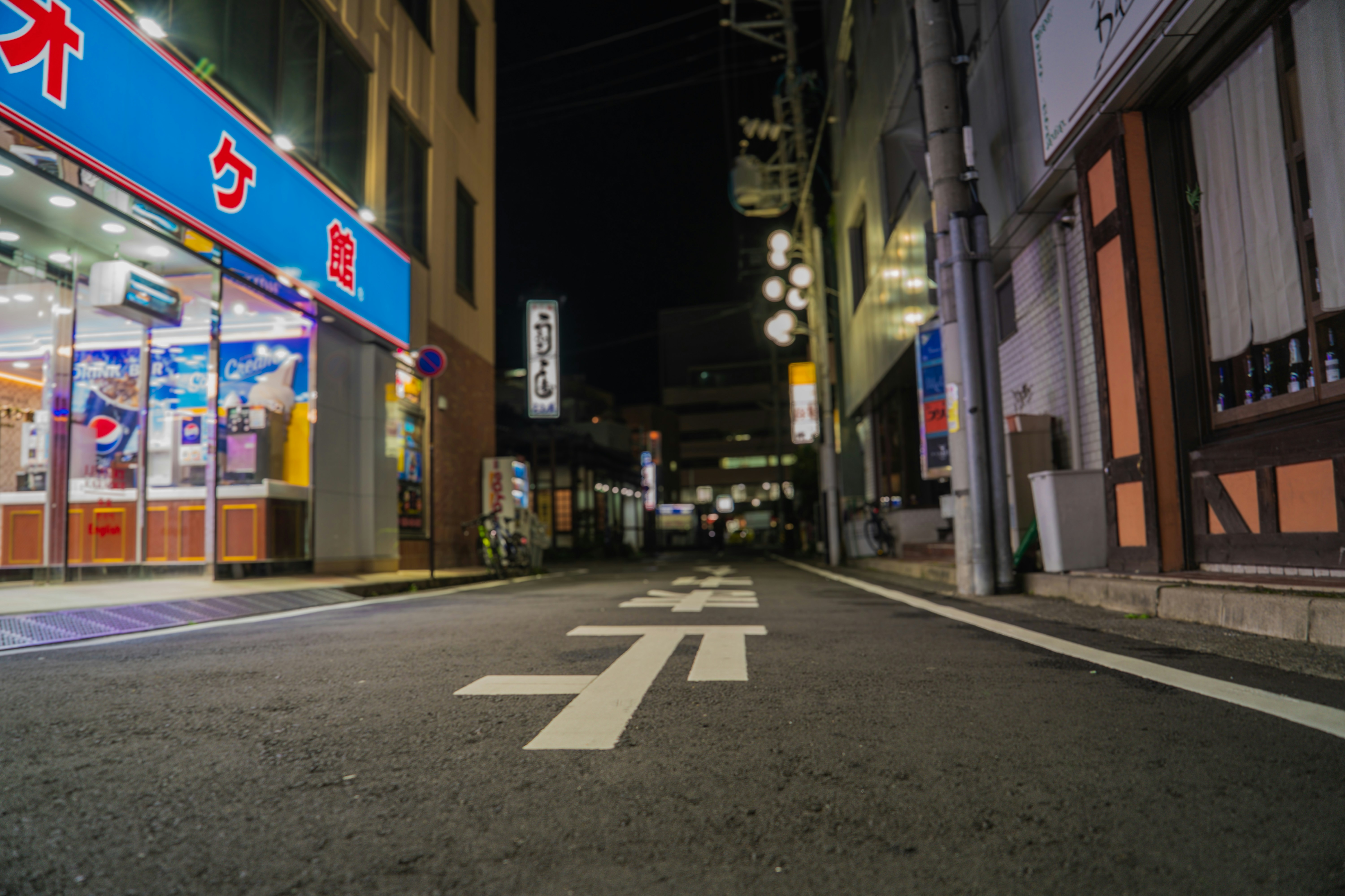 Neon Street Corridor: Evening Quiet Beneath City Lights