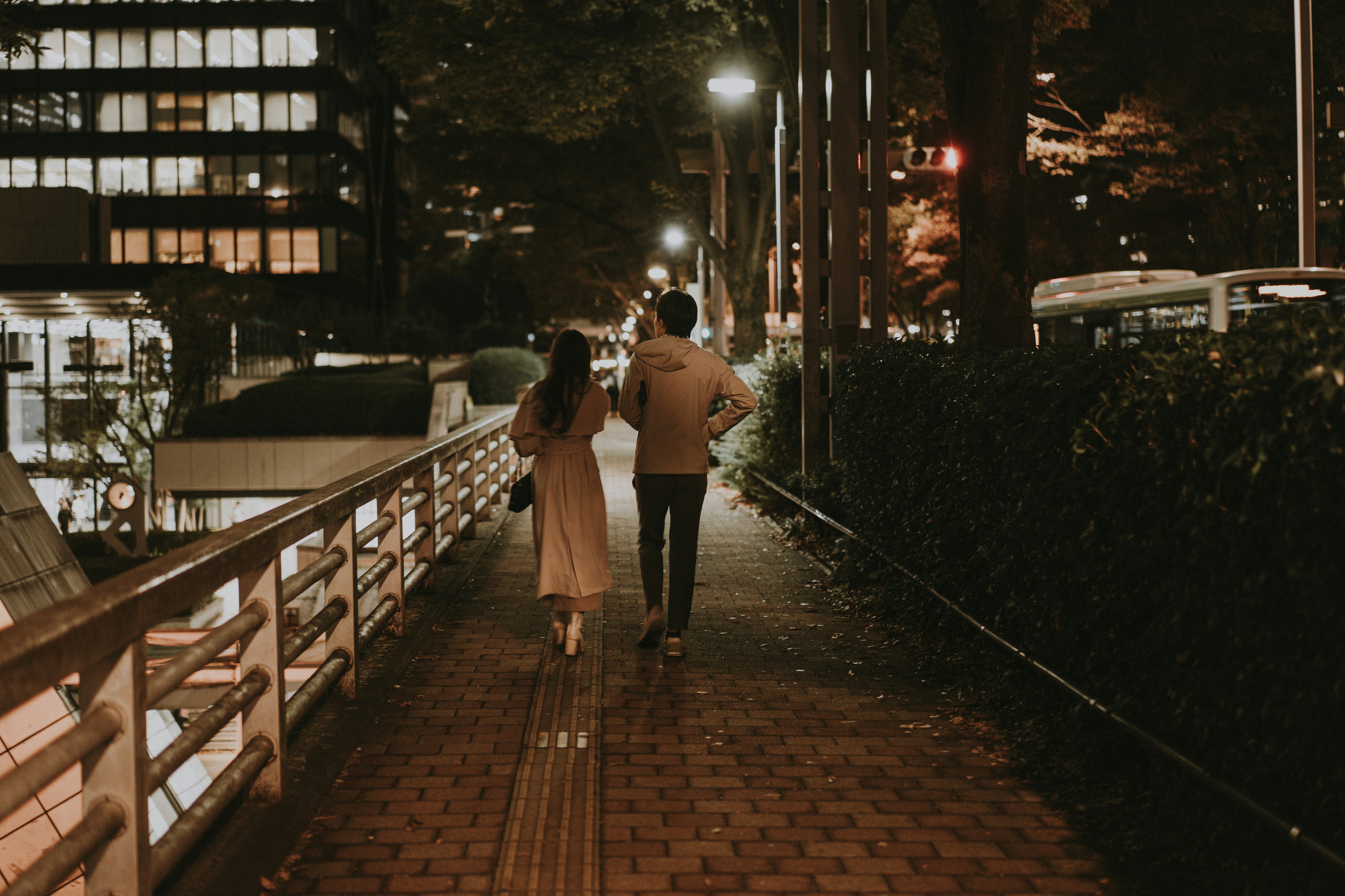 Two Night Walkers on a Quiet City Bridge