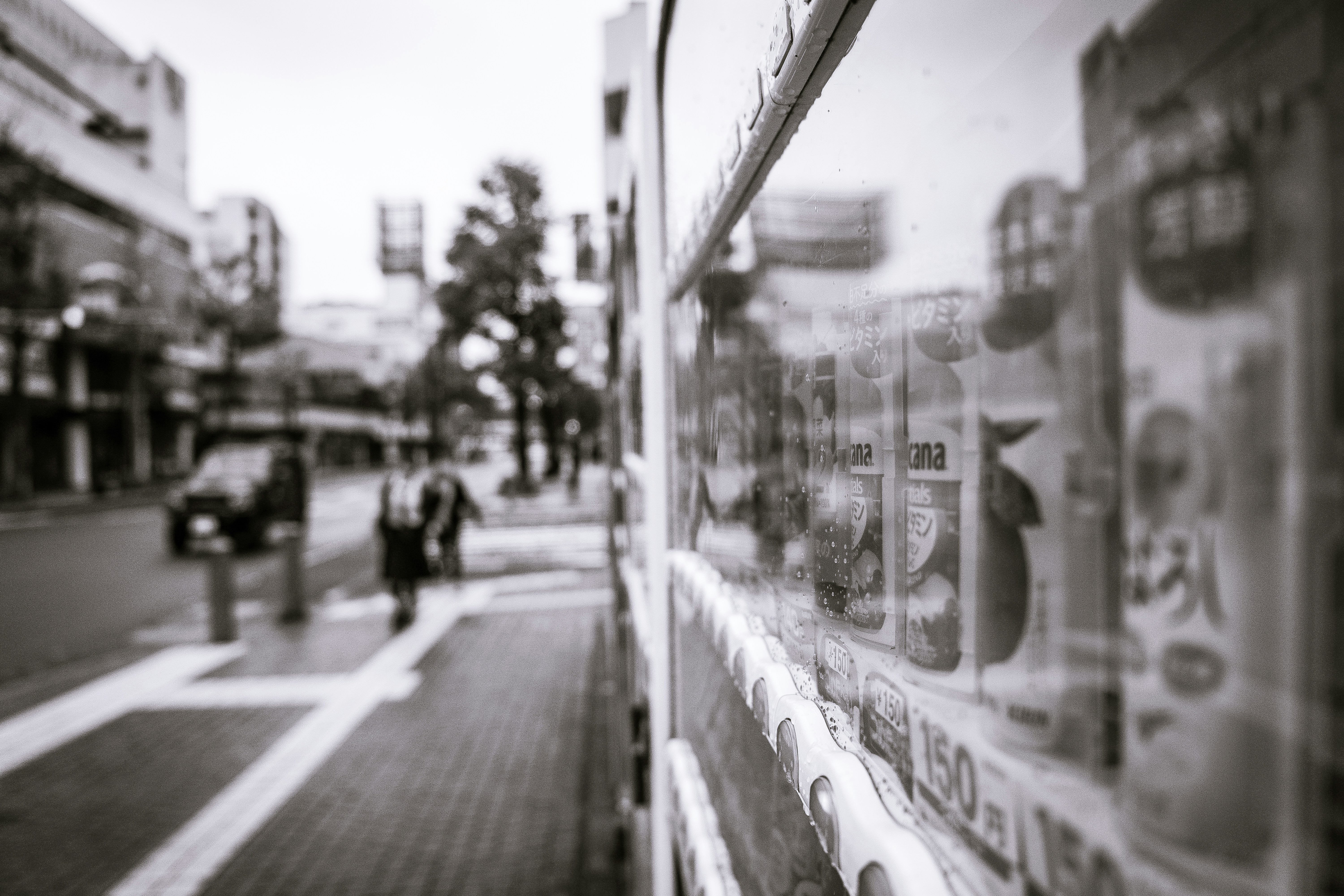 Reflections on the Glass Wall: A Quiet Street Through a Blurred Window