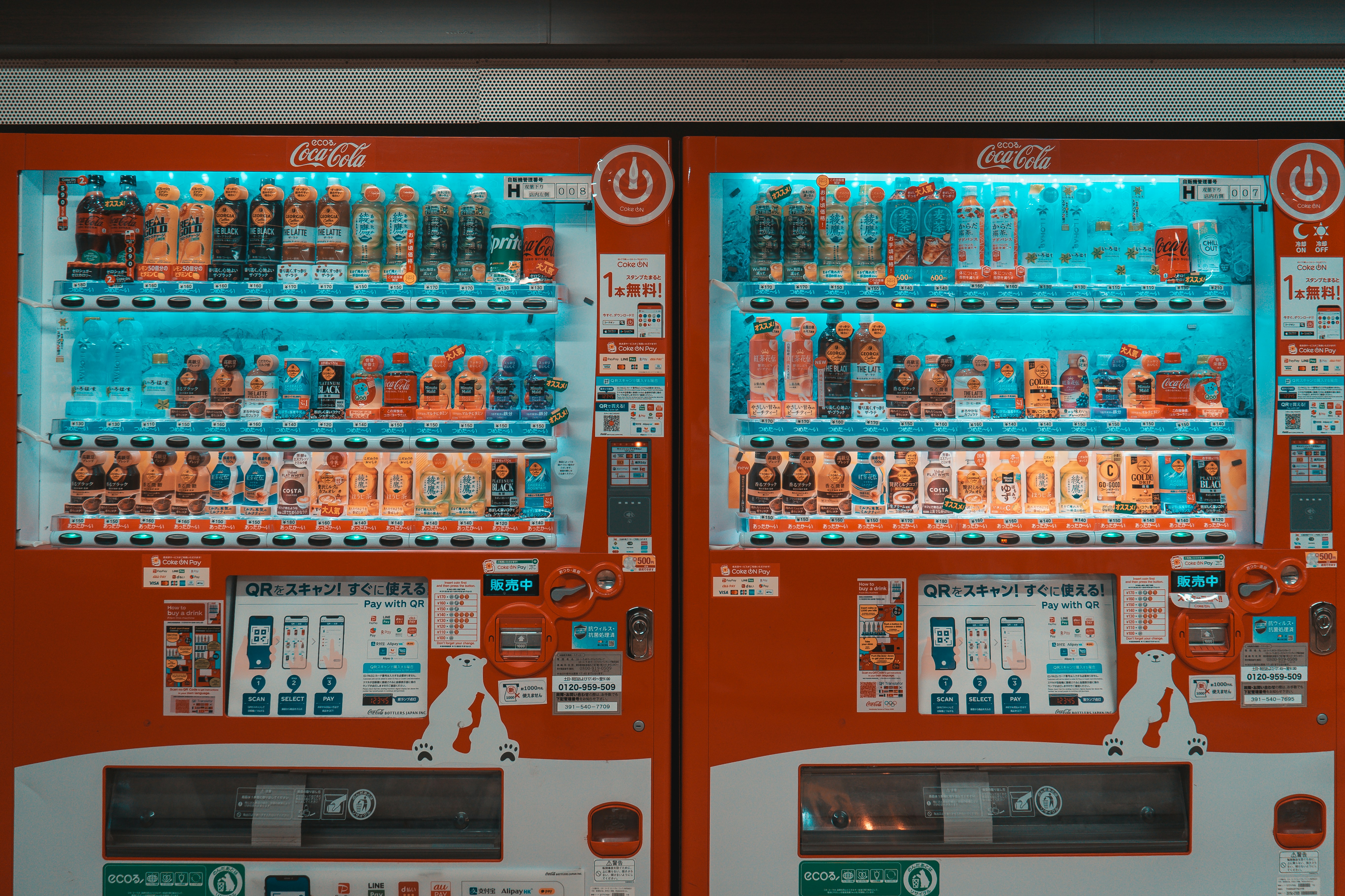 Twin Red Vending Machines: A Neon Corridor of Convenience