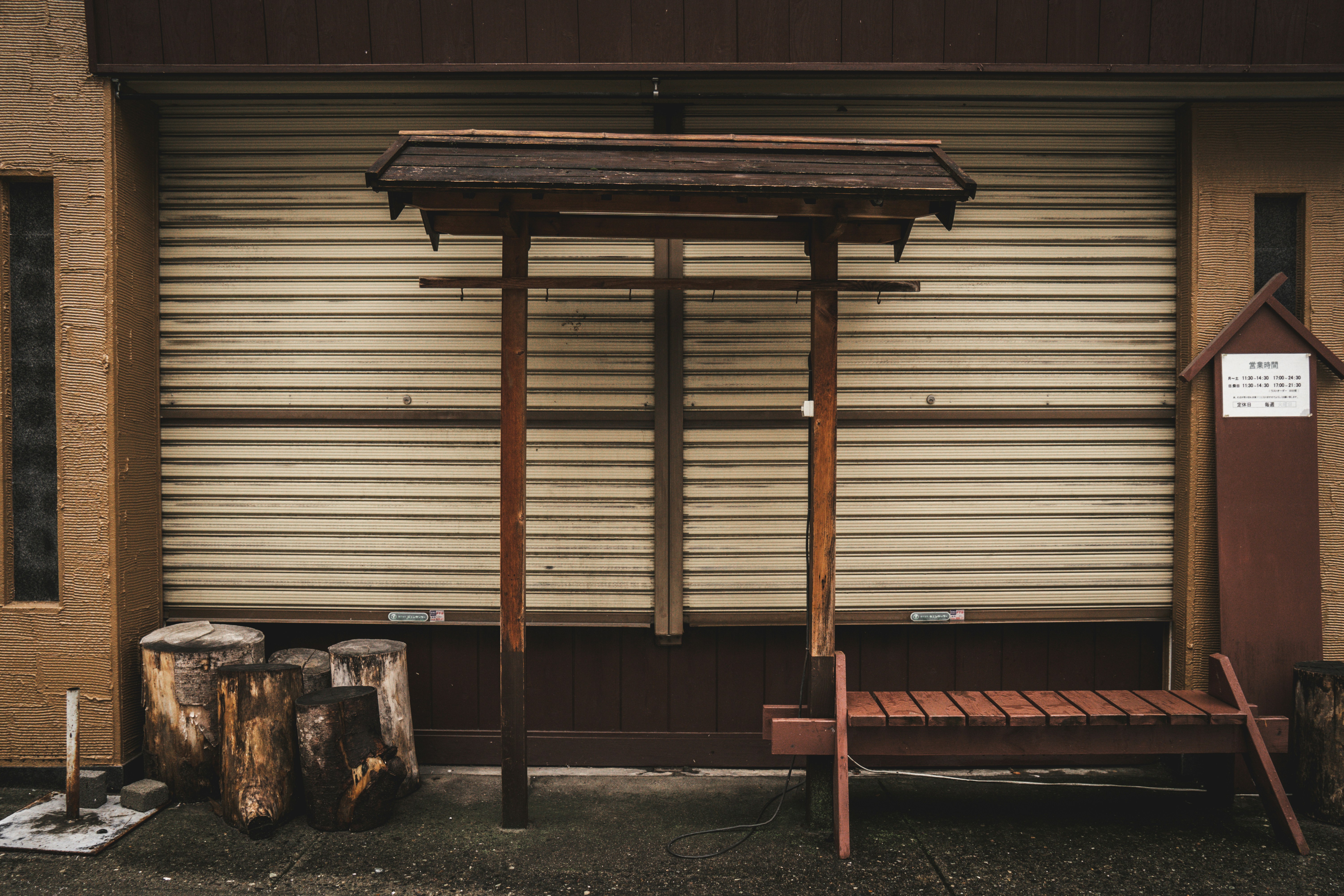 Silent Bus Stop Shelter in Front of a Closed Shopfront