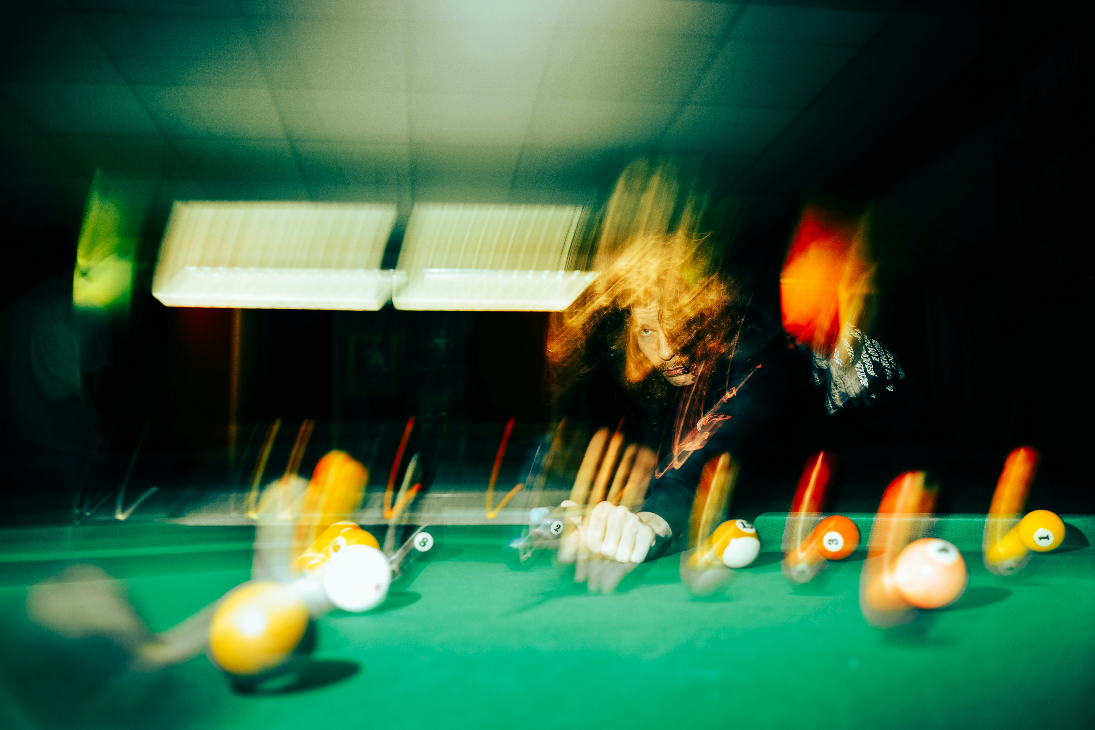 Blurry Break: A Frenzied Pool Table in Motion