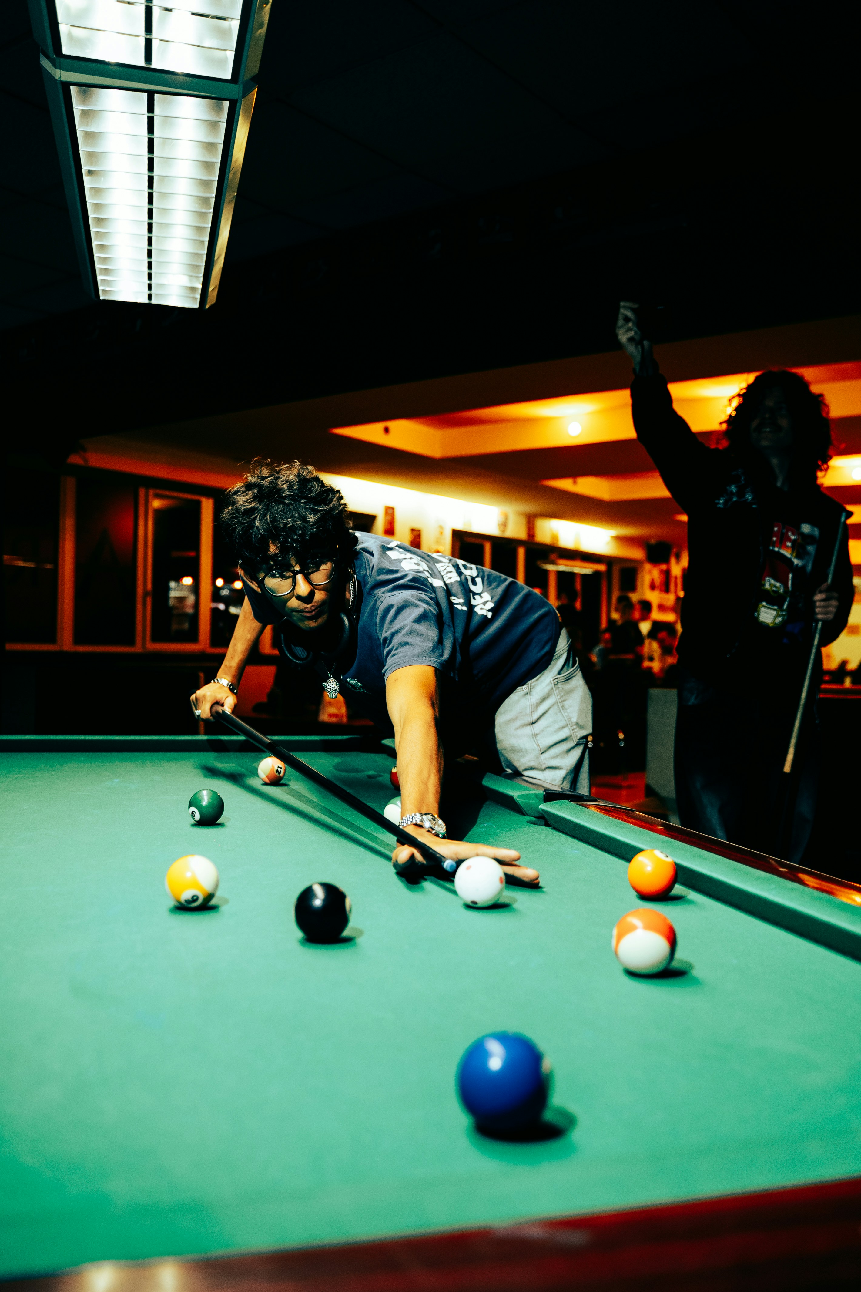 Cue Ball Conductor: Focused Play in a Dimly Lit Billiard Hall