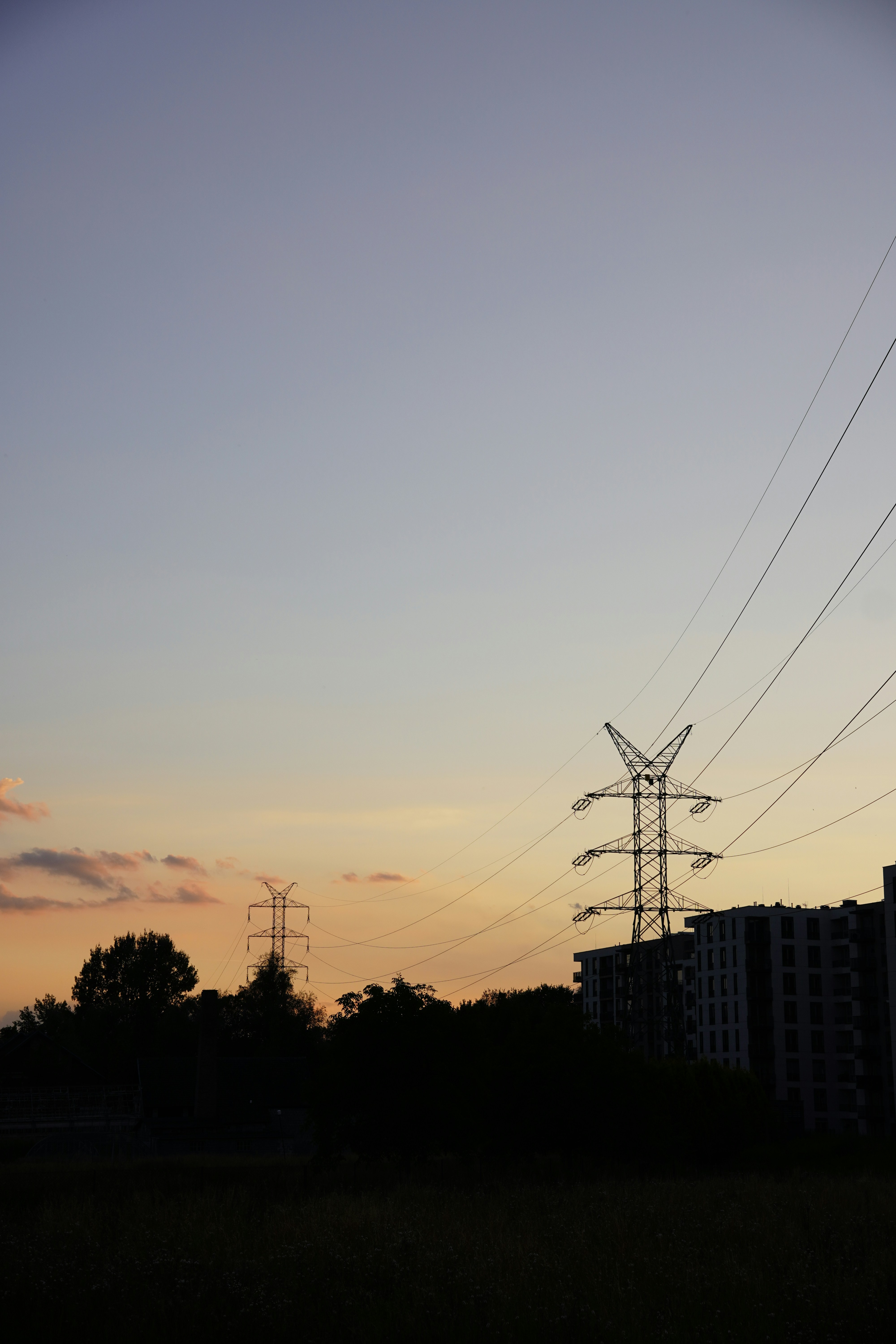 Rising Quiet: Power Lines against a Dusk Sky