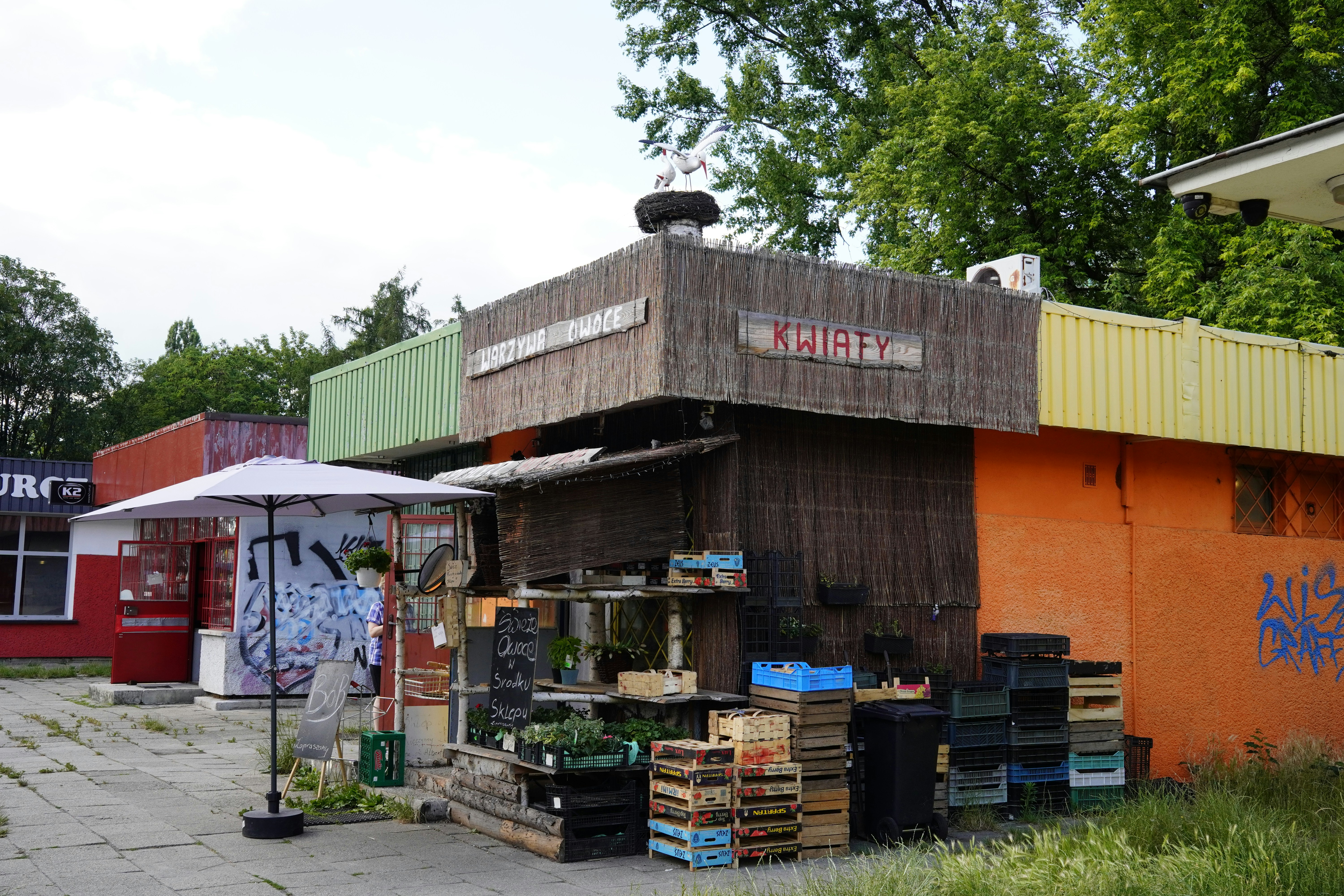 Colorful Market Shack with Crate Display and Umbrella Shade