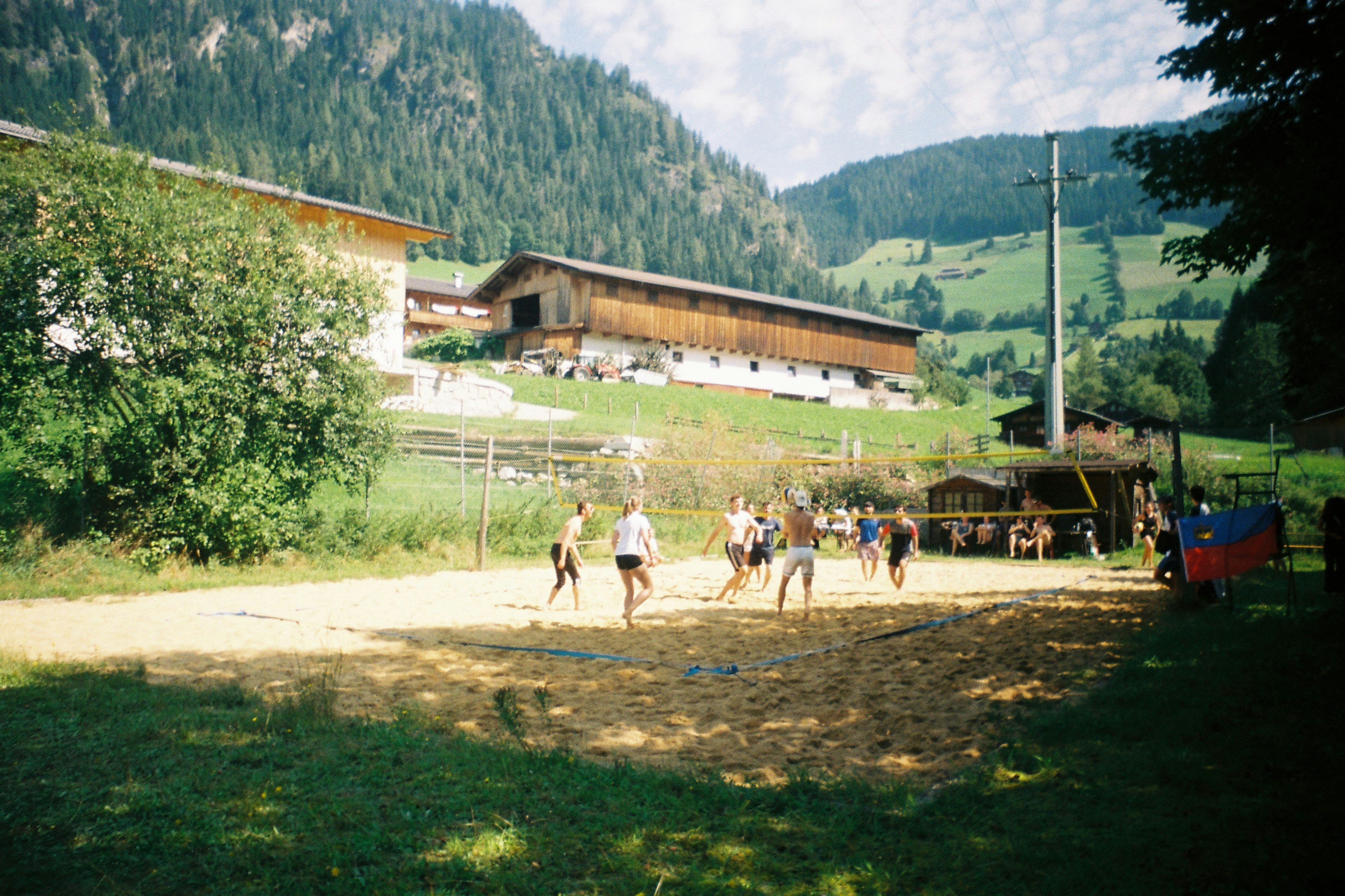 Sunlit Summer Bocce: Mountain Lodge Beach Scene