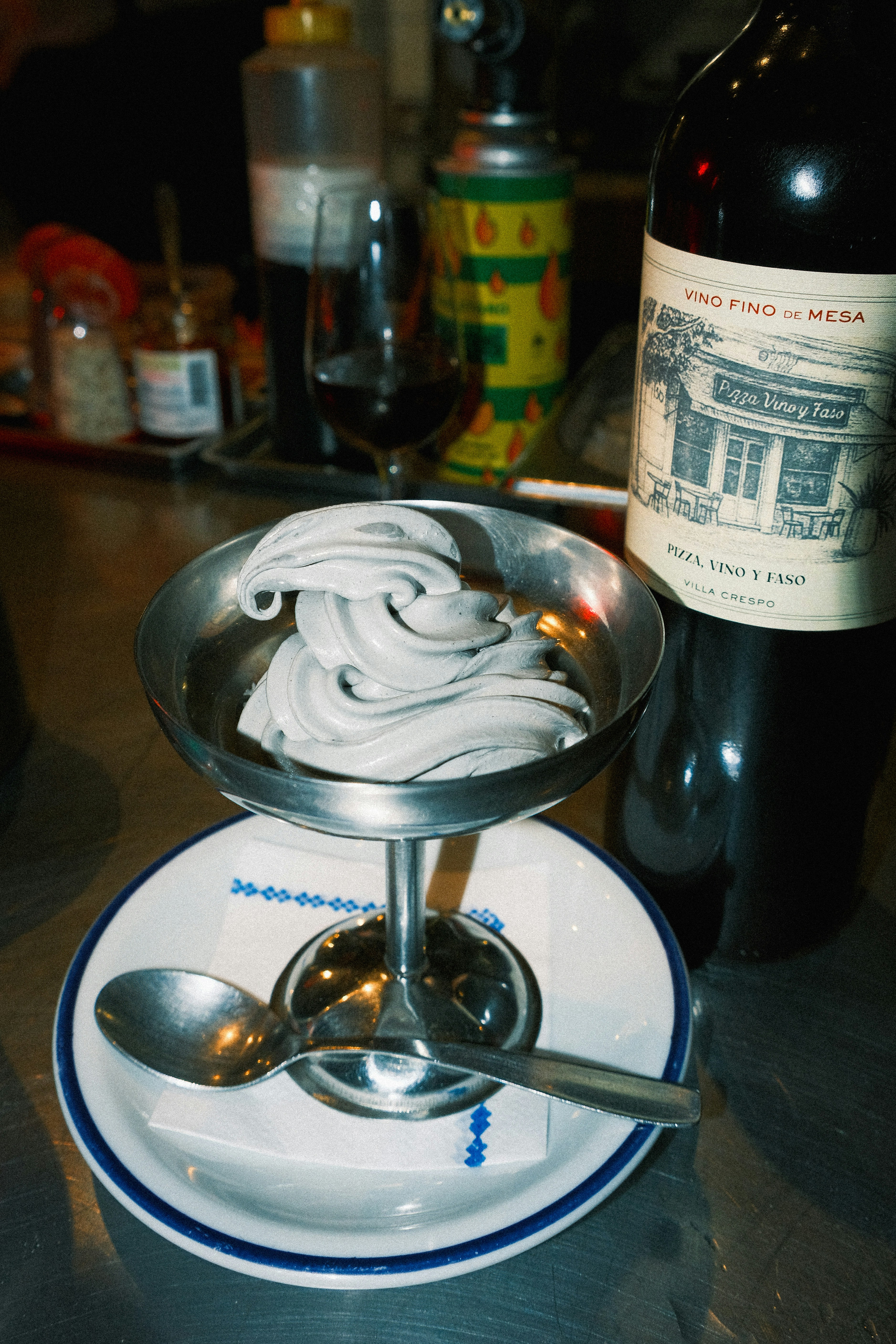 Velvet Mousse in a Martini Glass with a Bottle of Red nearby