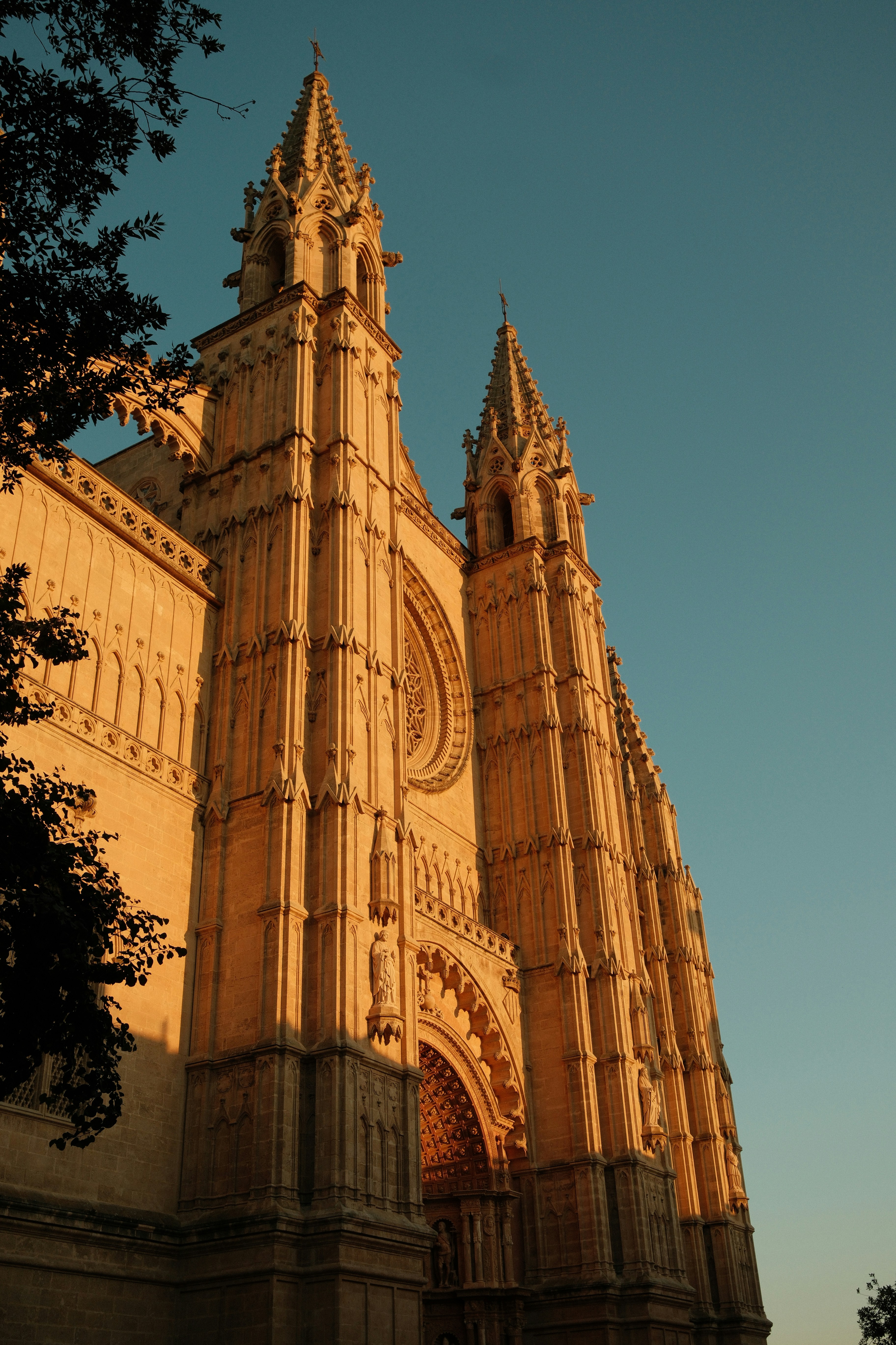 Gothic Grandeur: Towers Reaching Against the Evening Sky