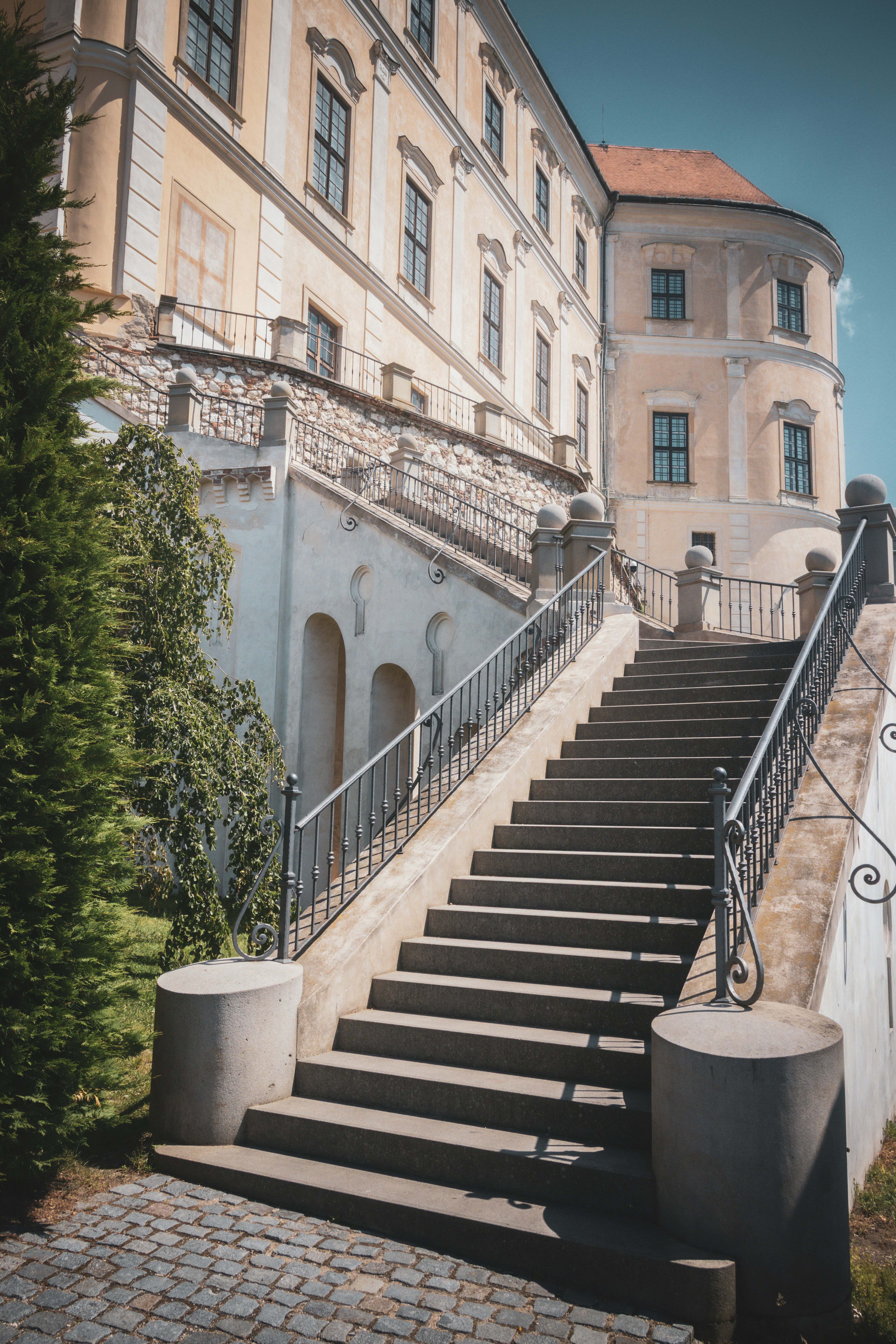 Staircase to the sunlit terrace of a historic villa