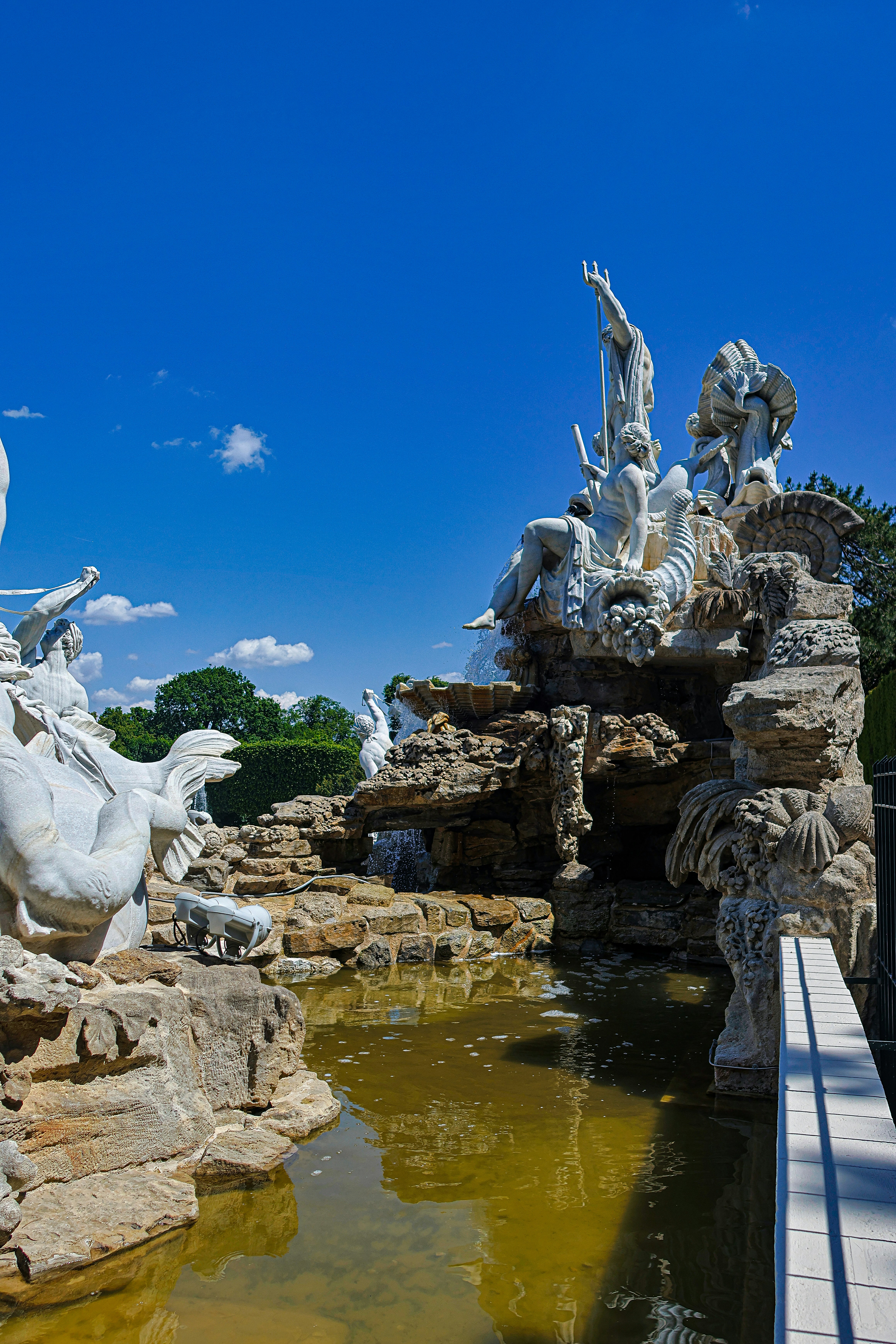 Dragon and Waves: Sculpted Mirage Over a Reflective Pool