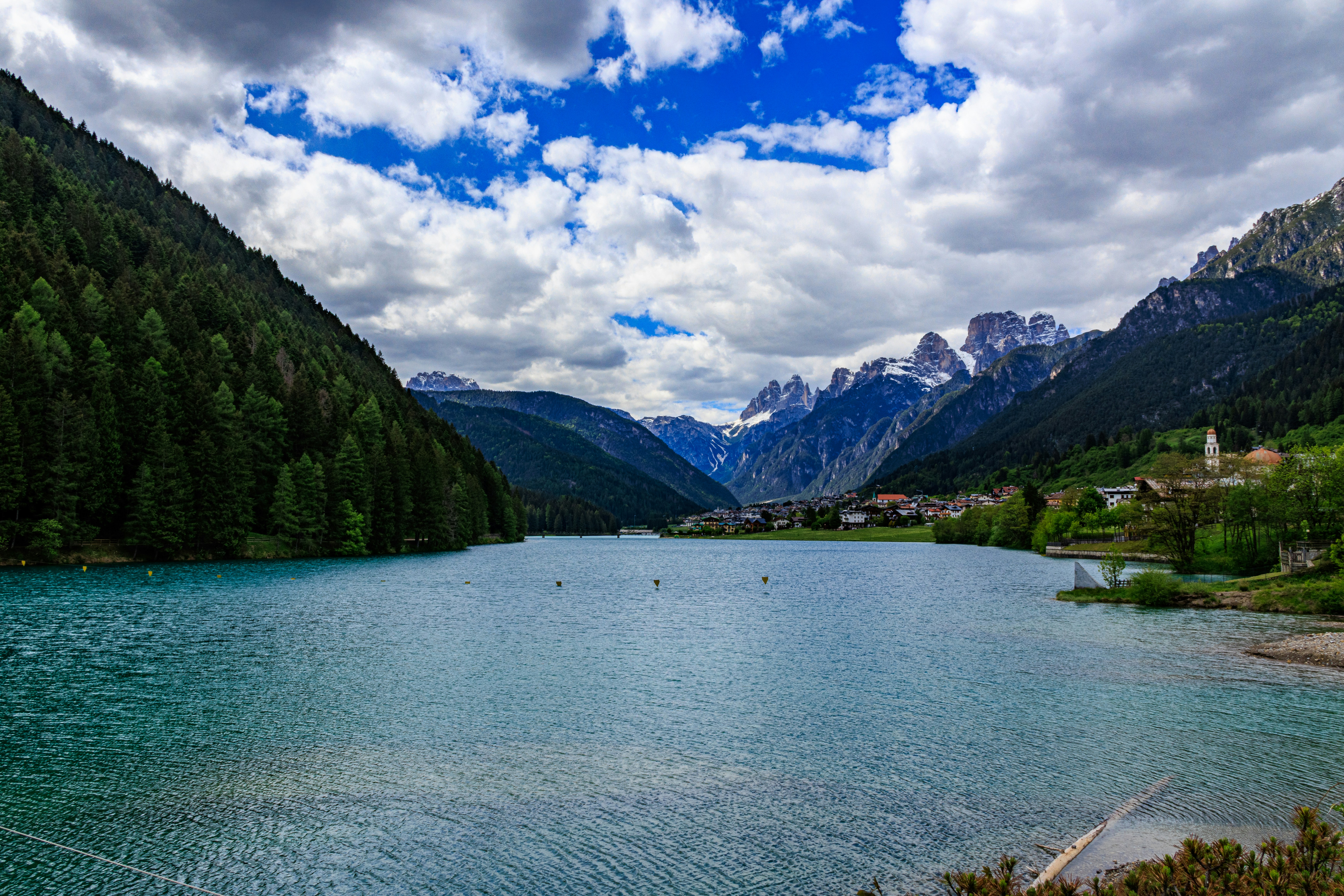 Emerald Lakebound: Alpine Waters Under Vast Sky