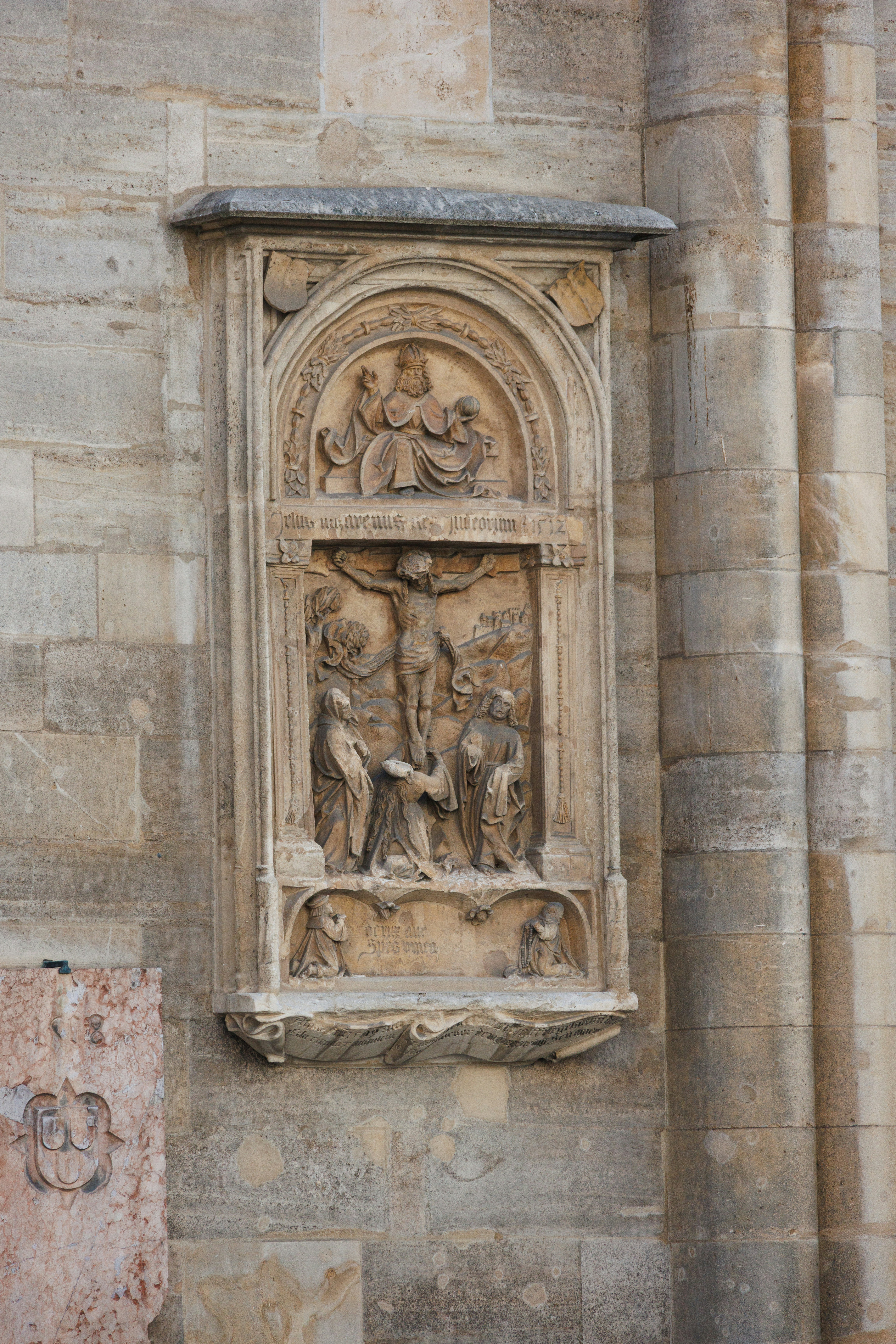 Stone Carved Gospels: A Relieved Christ and Apostles Panel on a Weathered Cathedral Wall