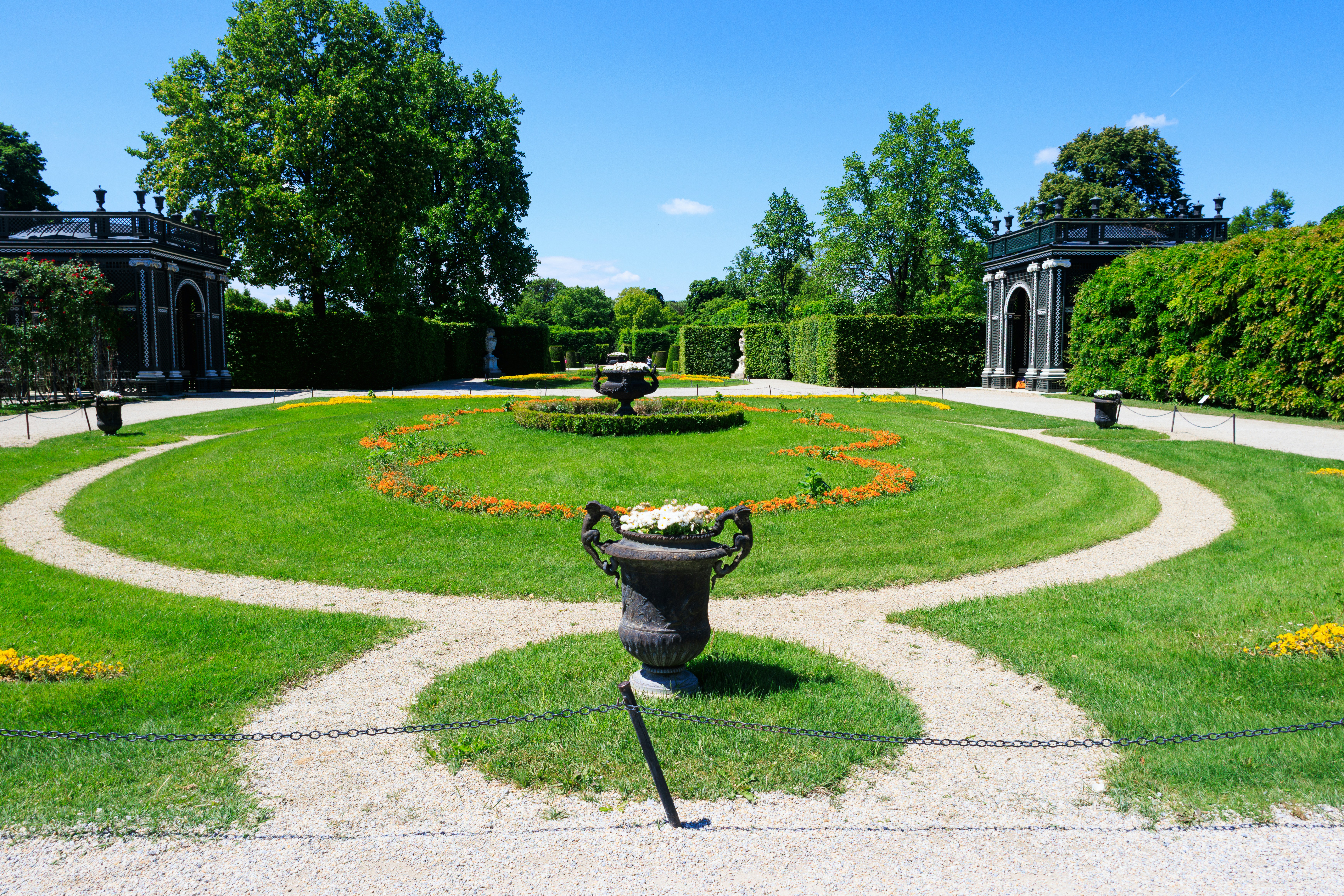 Central Urn in Formal Garden Framed by Symmetrical Pathways
