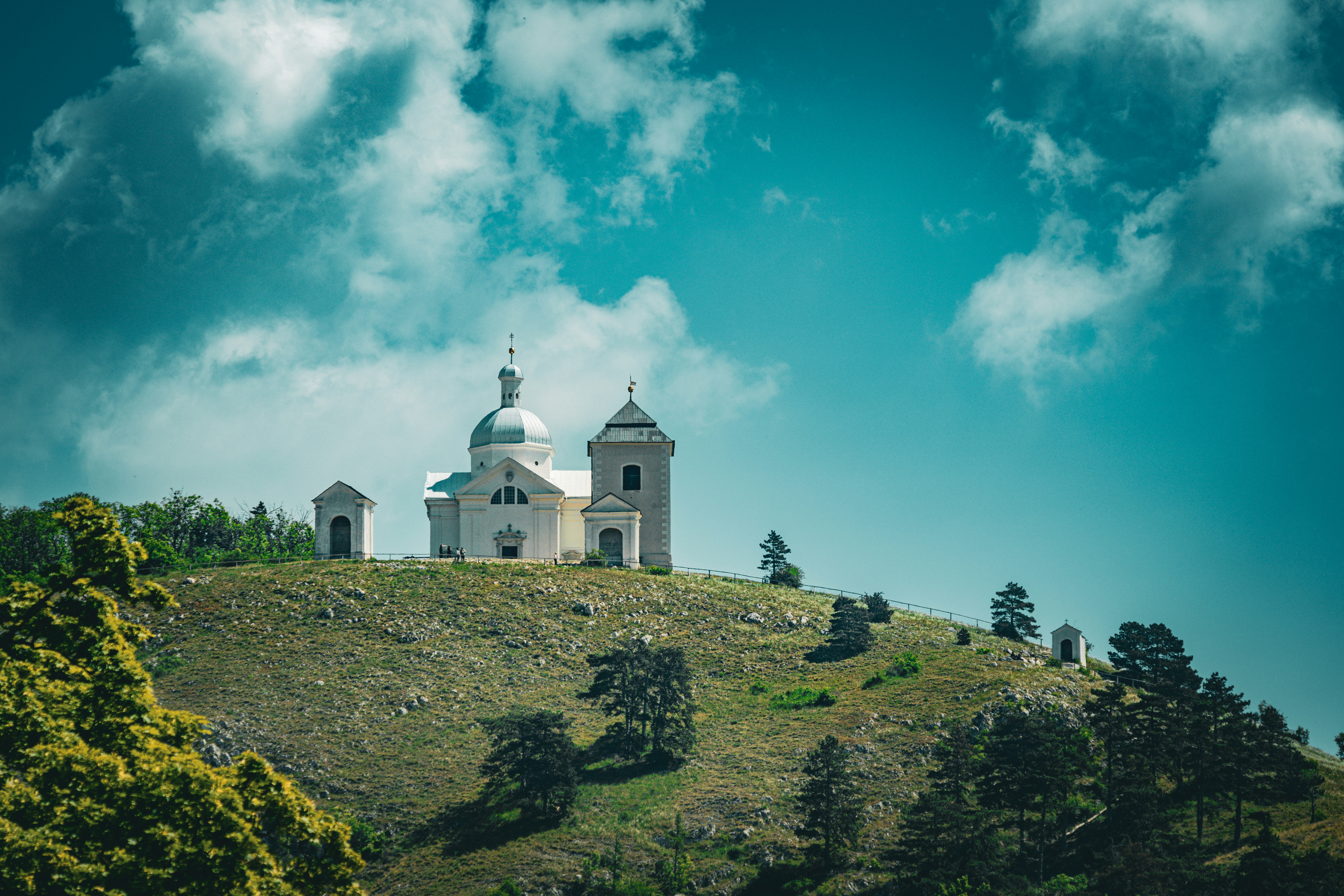 Hilltop Sanctuary: A Stucco Church Standing Against the Sky