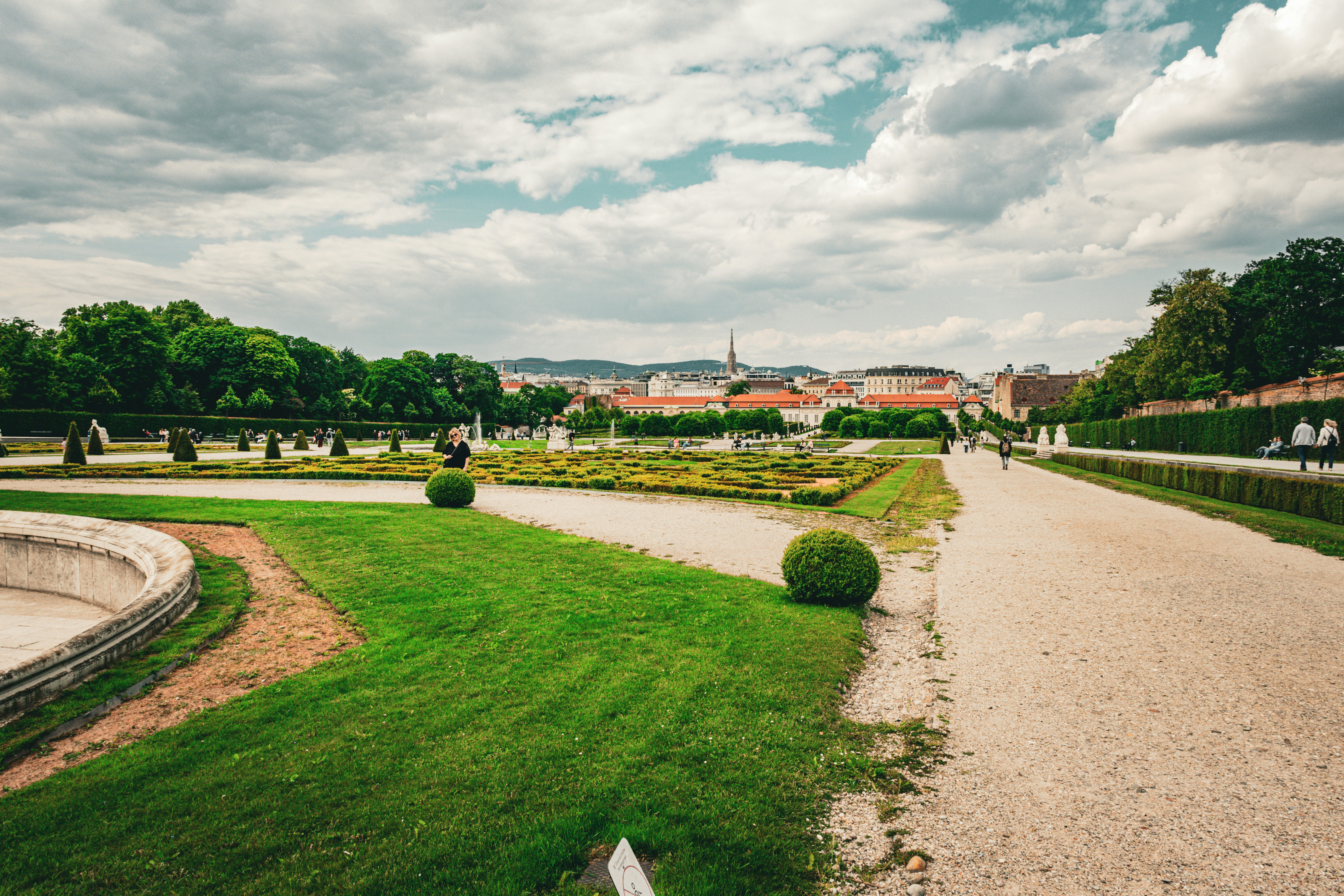 Neatly manicured formal garden with distant chateau silhouette