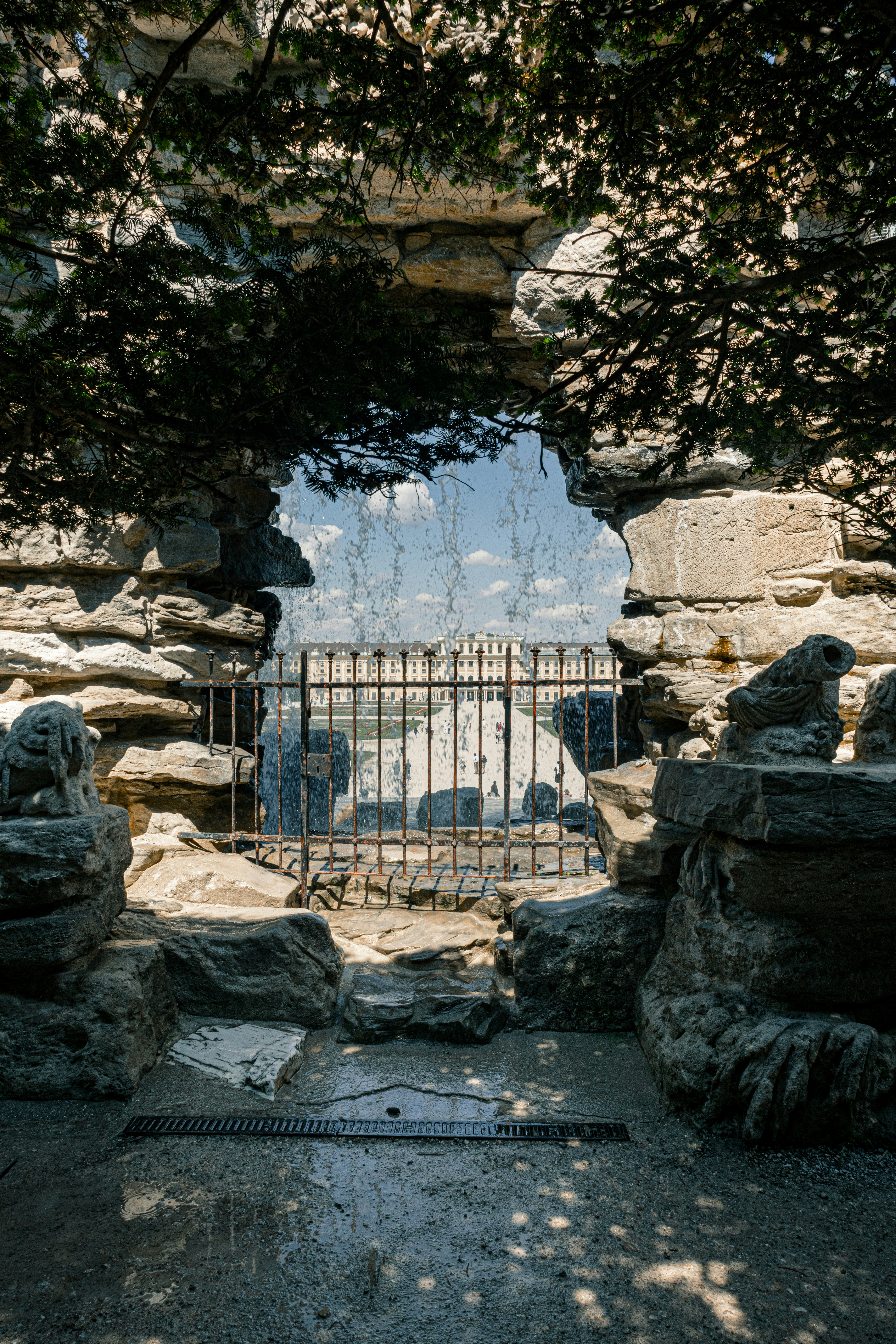 Window to the City: A Stone Archway Framing a Distant Terrace
