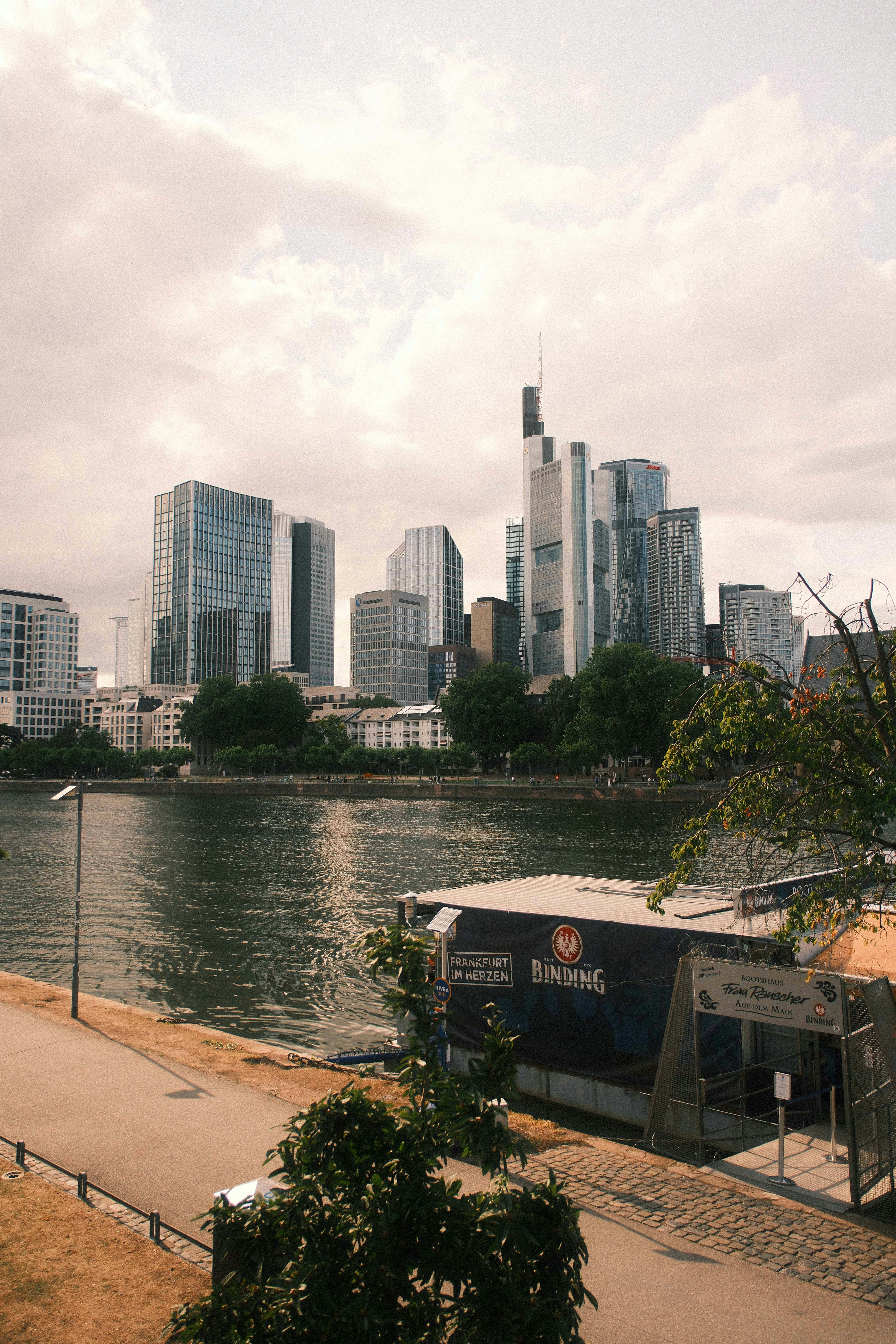 Riverfront Skyline Across a Reflective Marina
