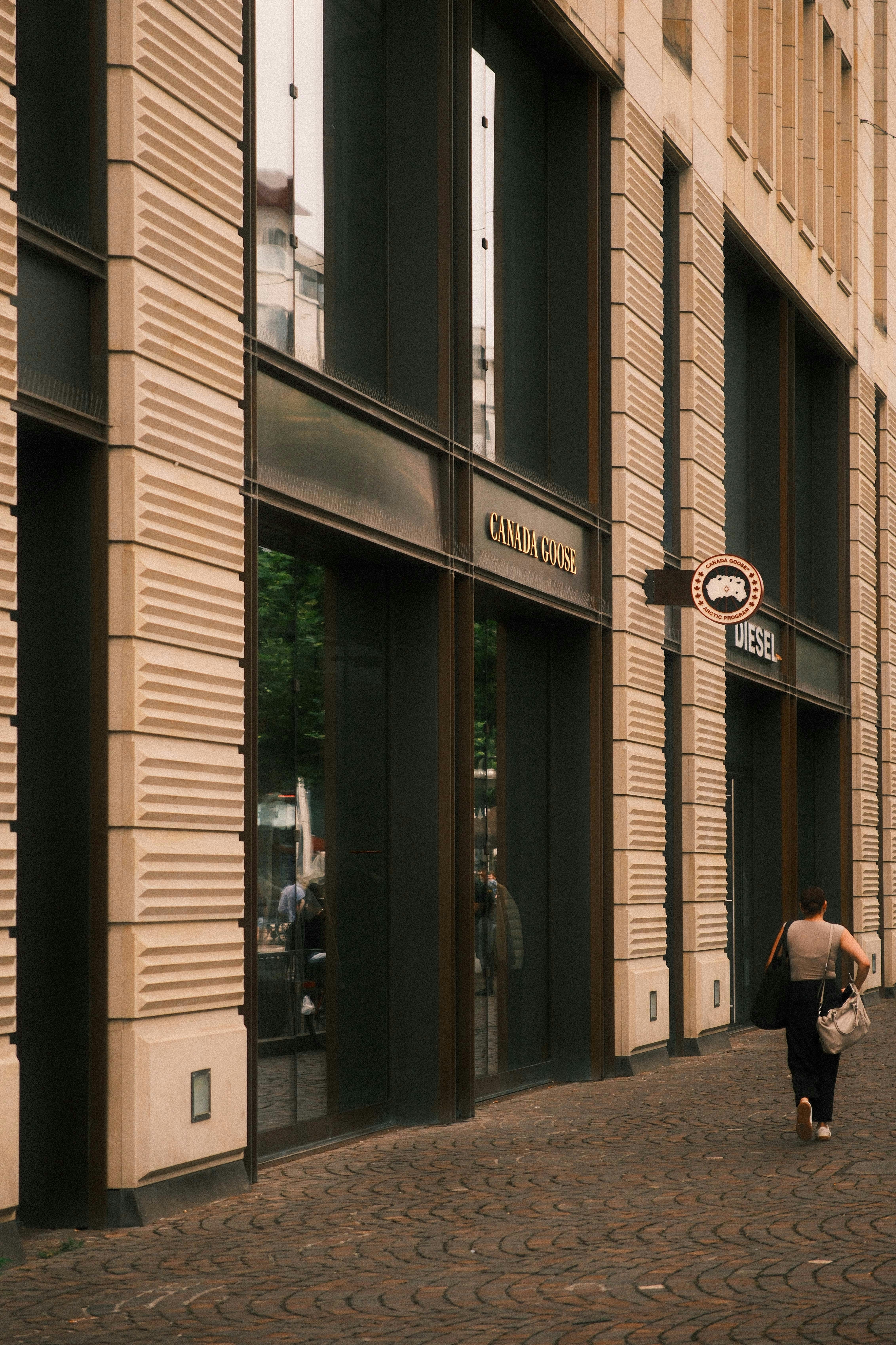 Urban Passage: A Quiet Moment Outside a Luxe Shopfront