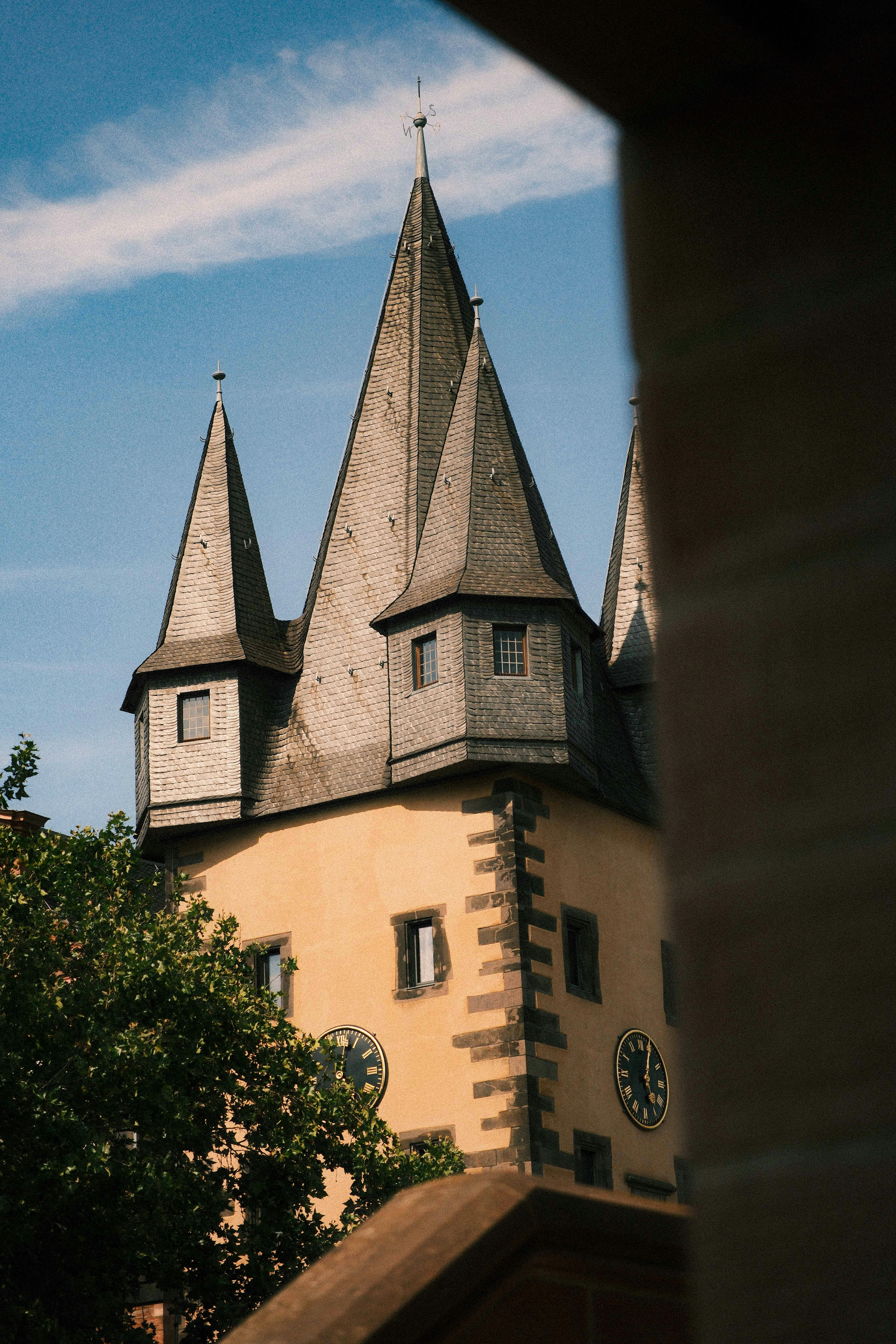 Castle Cornerstone: three towers framed by a sunlit facade